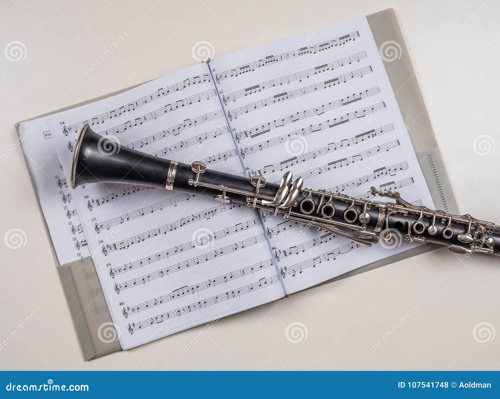 Clarinet Lays Over the Book with Notes Stock Photo - Image of band ...