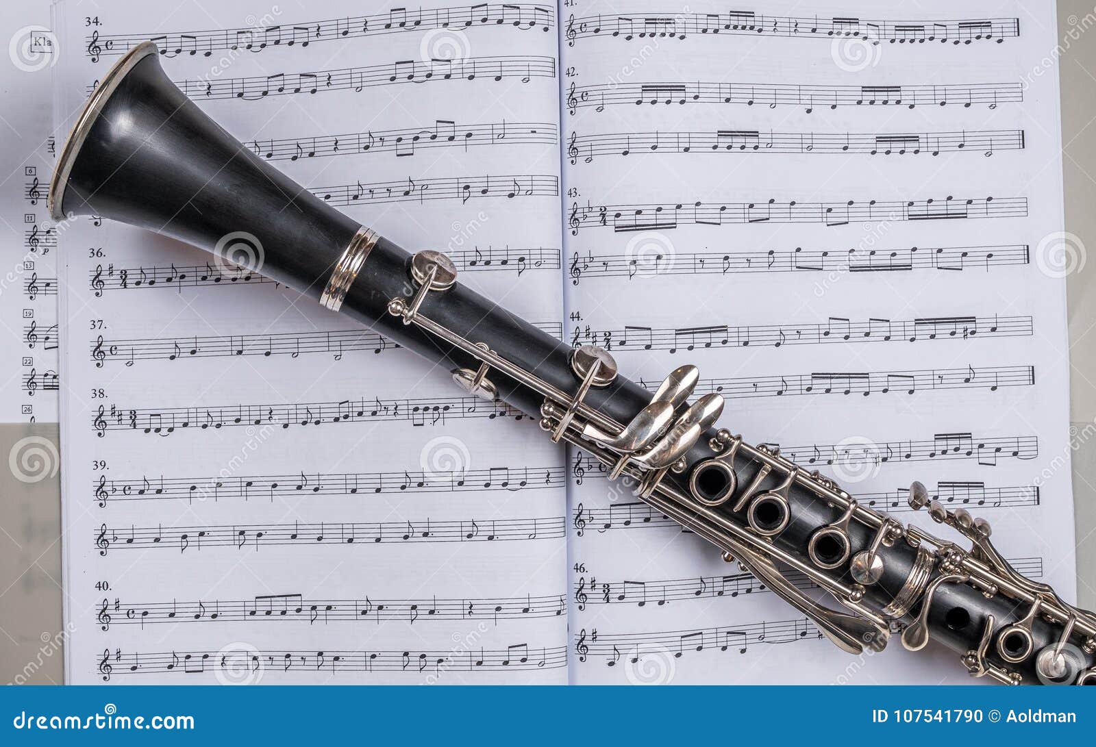 Clarinet Lays Over the Book with Notes Stock Photo - Image of book ...