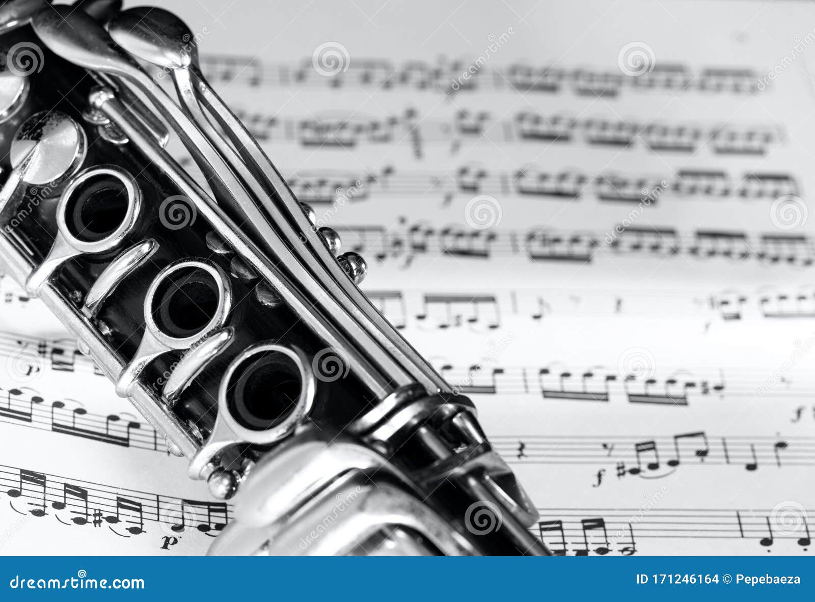 Clarinet on Music Partiture Background Stock Photo - Image of ligature ...
