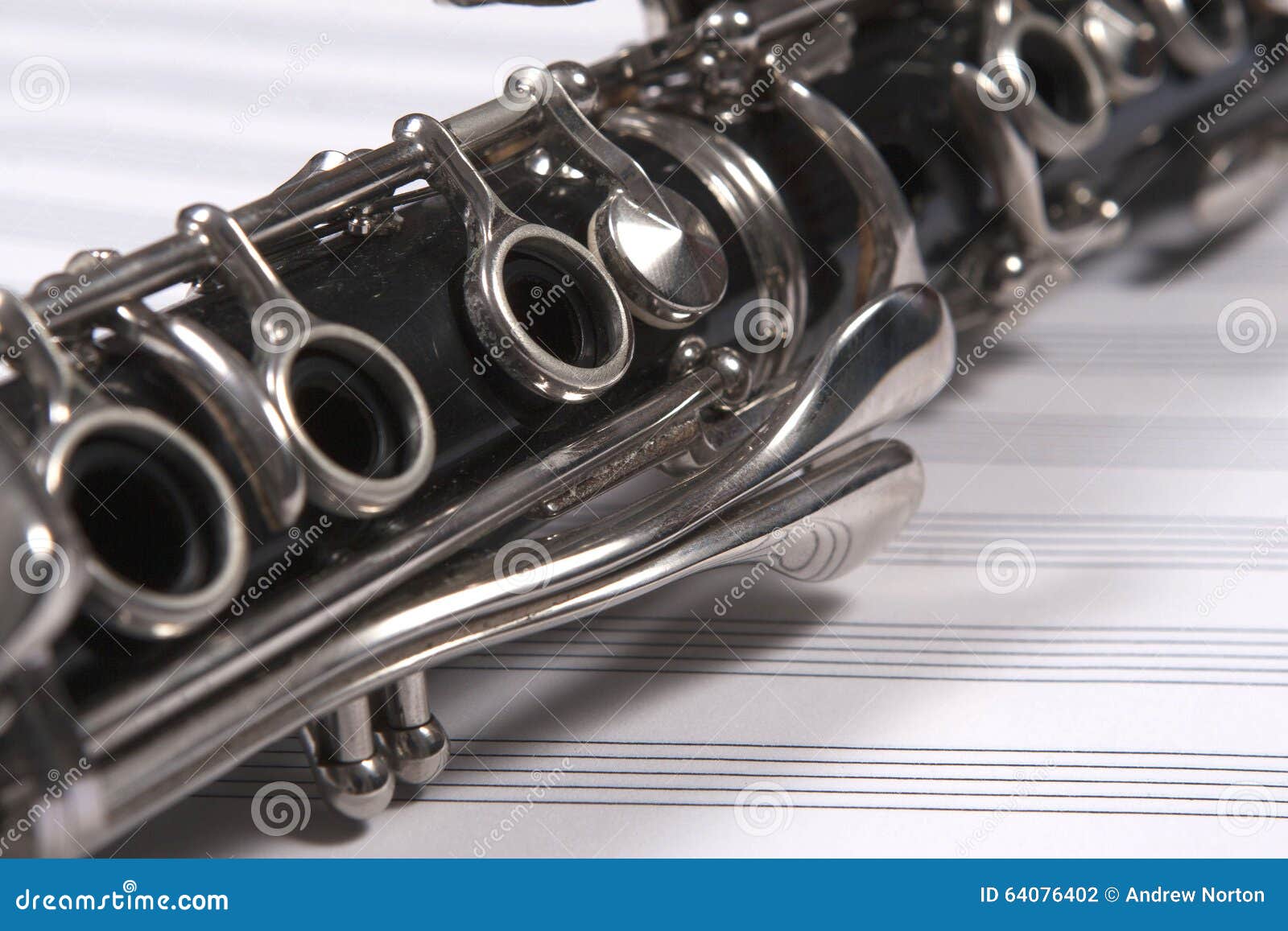 Clarinet on white staves stock photo. Image of orchestra - 64076402