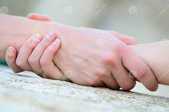 Clasped hand for help stock photo. Image of holding, extreme - 26989816