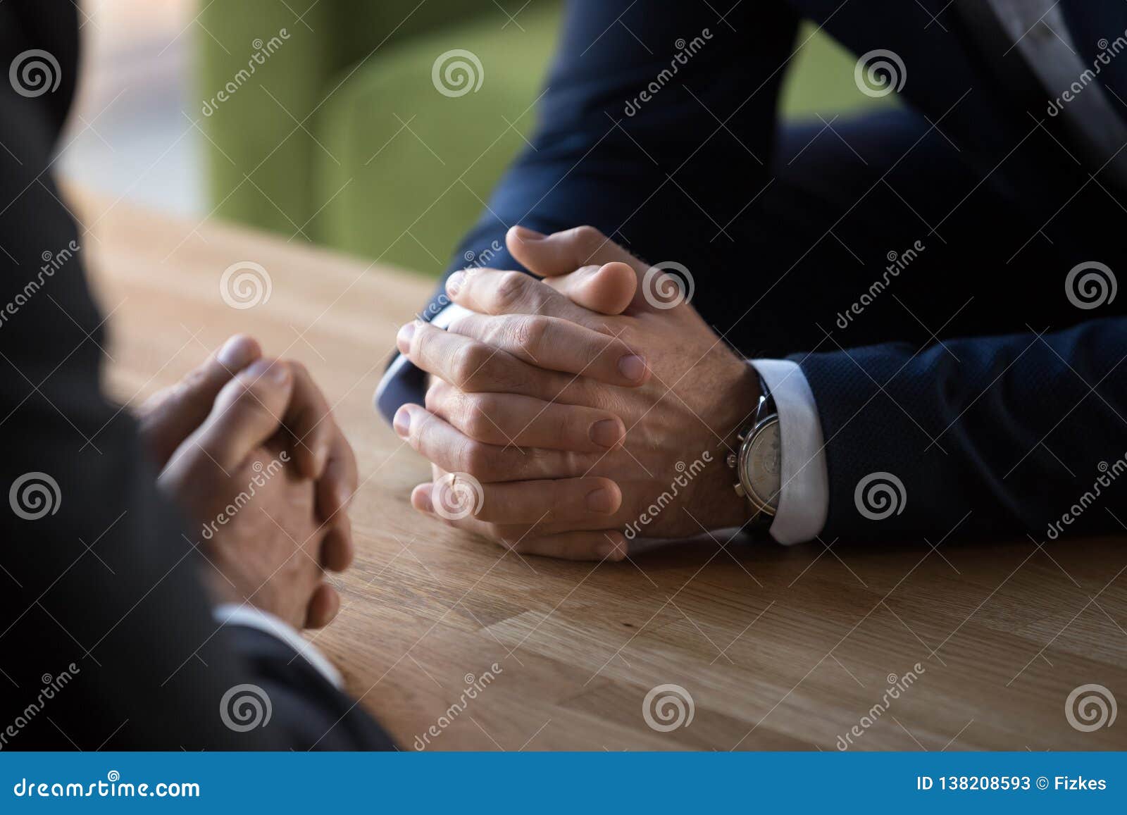 Clasped Male Hands of Two Businessmen Negotiating at Table Stock Image ... Clasped Male Hands of Two Businessmen Negotiating at Table Stock Image ...