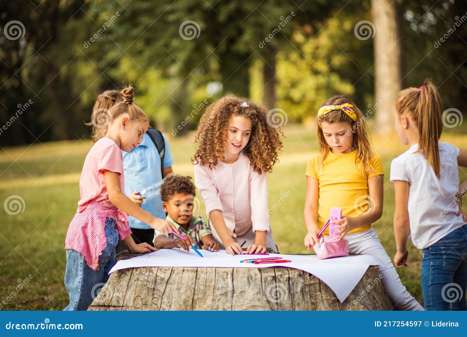 Large Group of People Writing Together in the Park Stock Image - Image ...