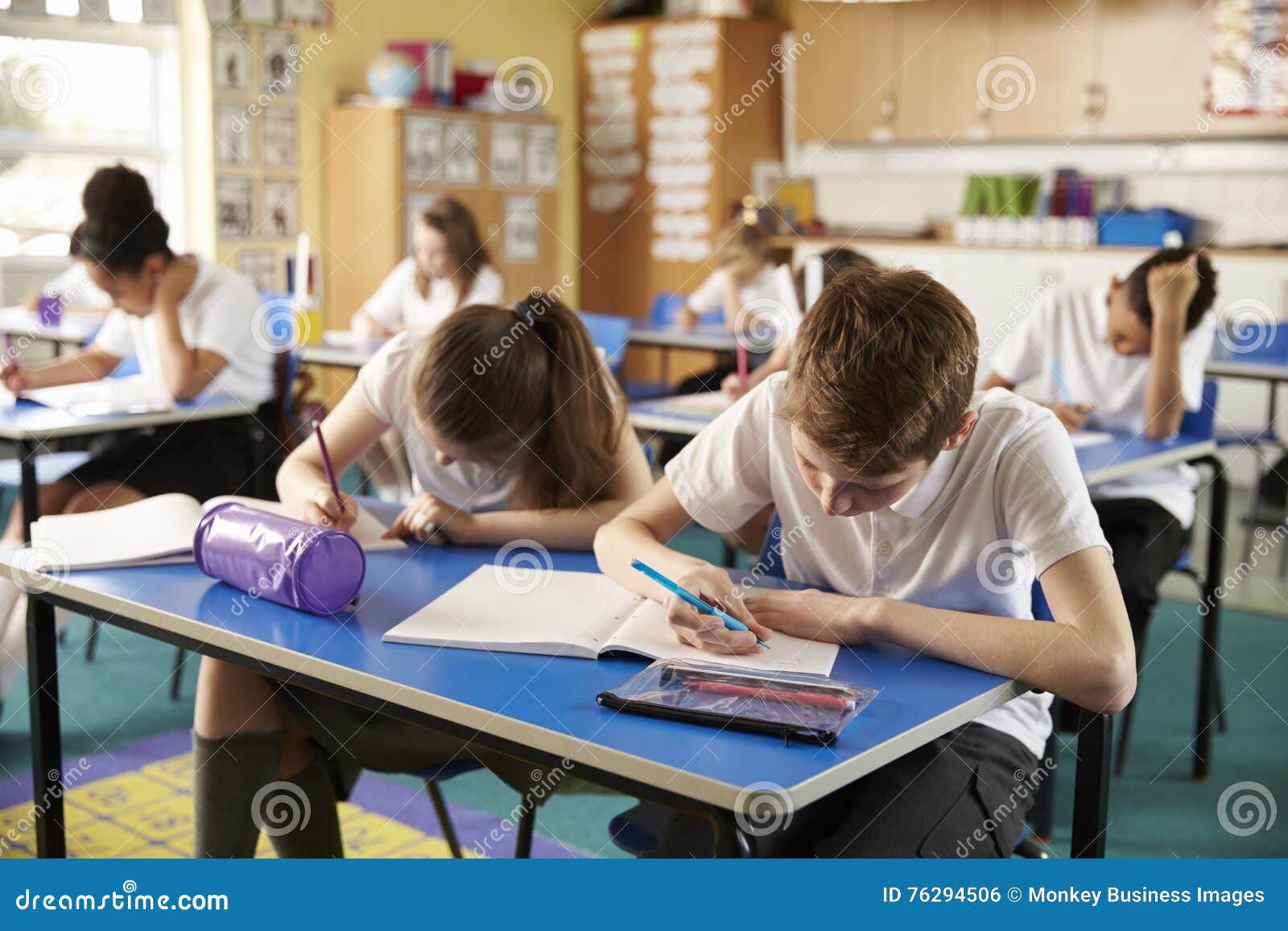 Class of Primary School Kids Studying during a Lesson, Close Up Stock ...