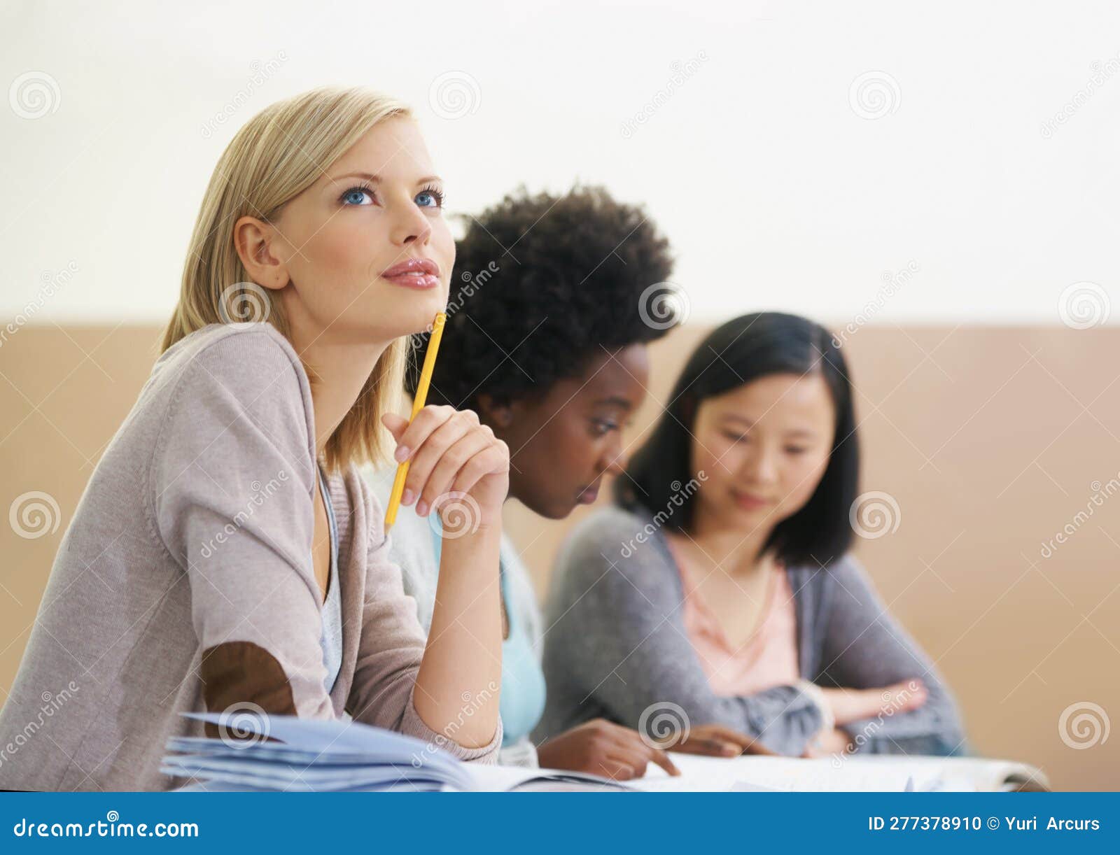 Class is in Session. Female University Students Sitting in an Exam Room ...