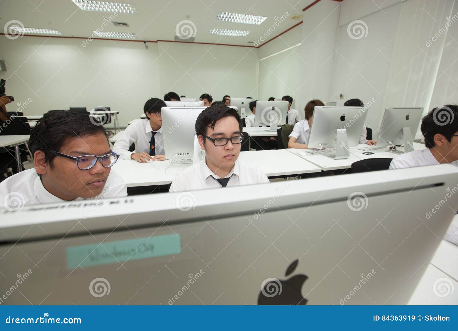 A Class of Students in Front of Their Screens Study Computer Science ...