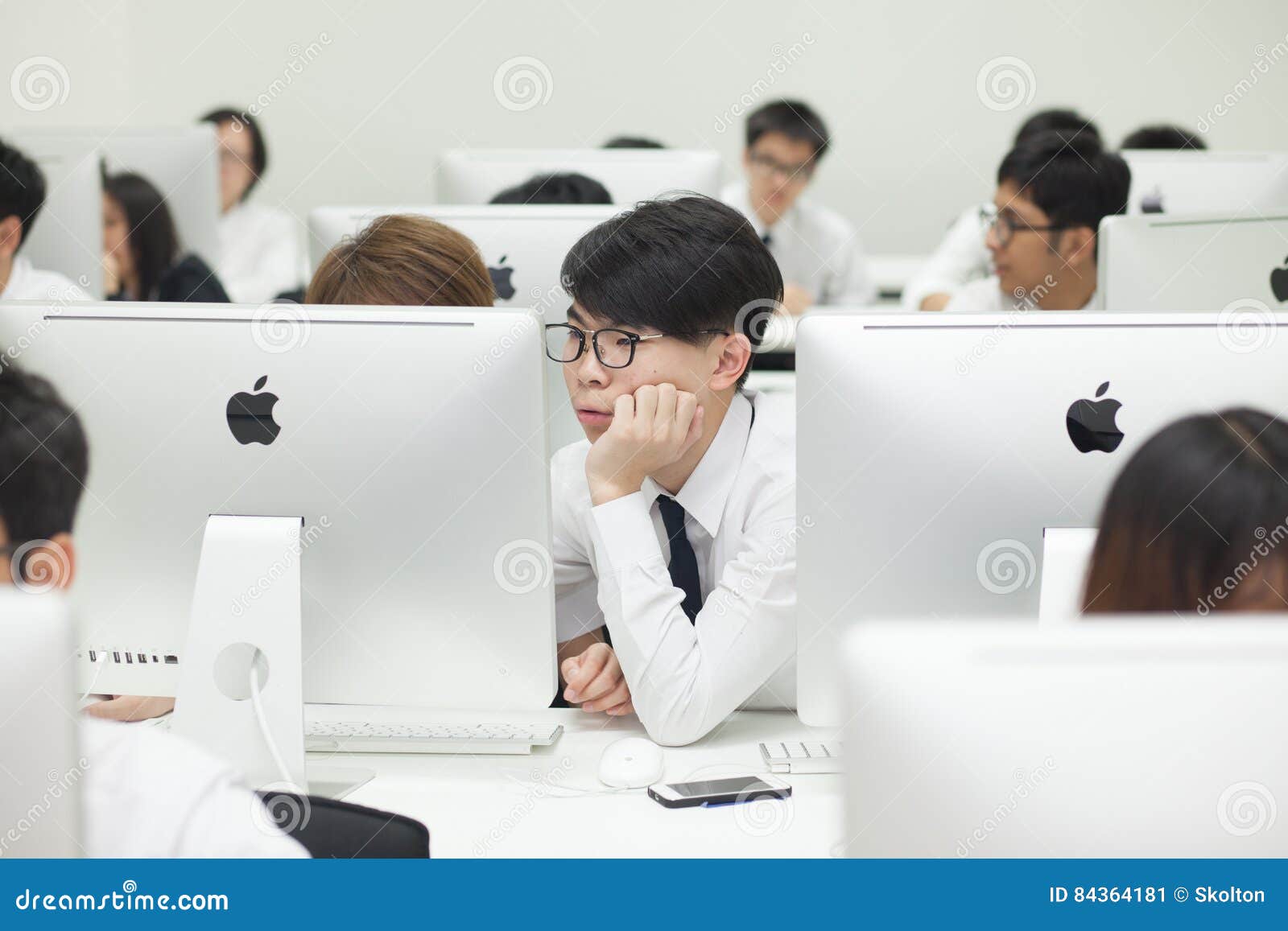 A Class of Students in Front of Their Screens Study Computer Science ...
