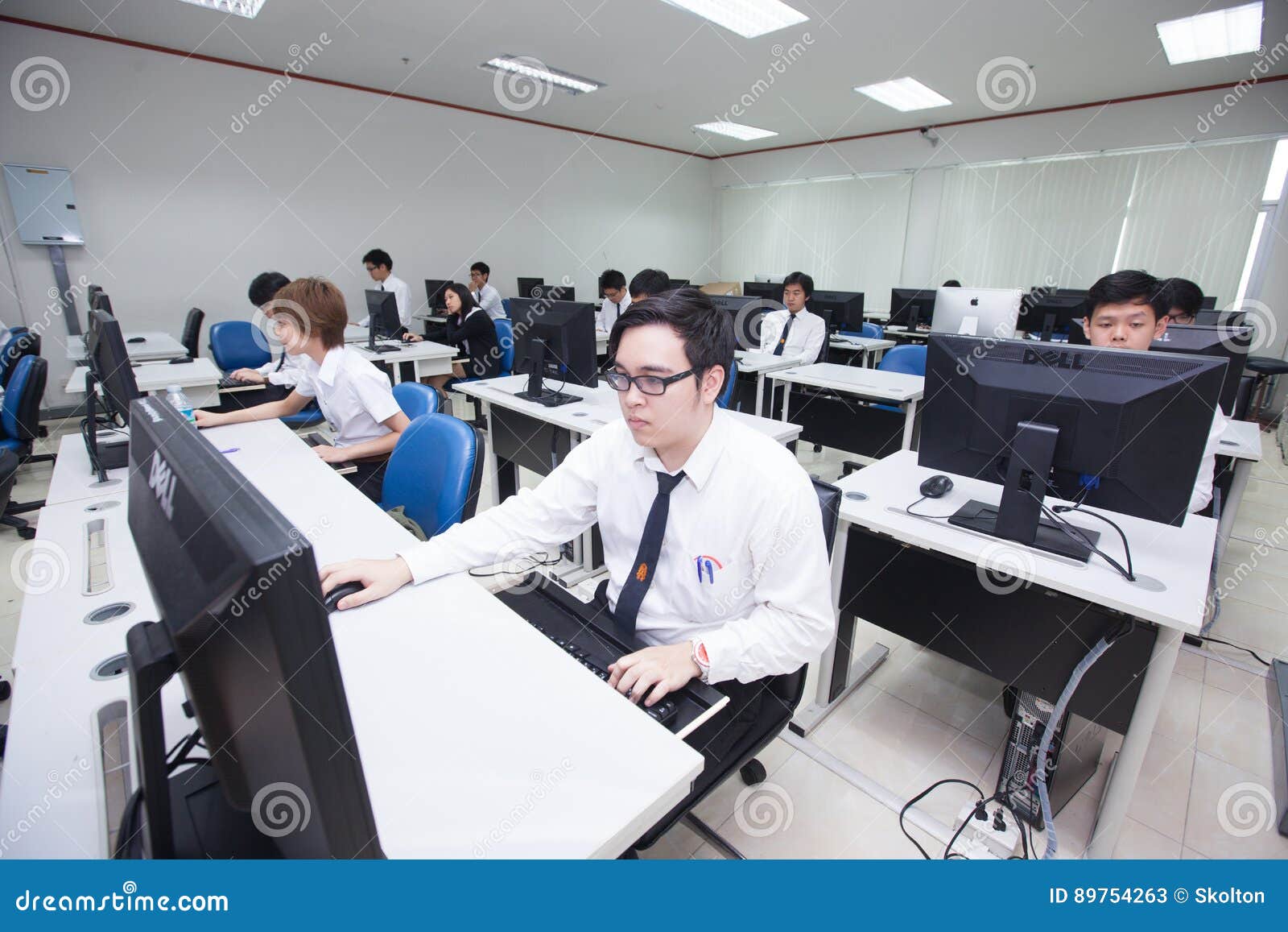 A Class of Students in Front of Their Screens Study Computer Science ...