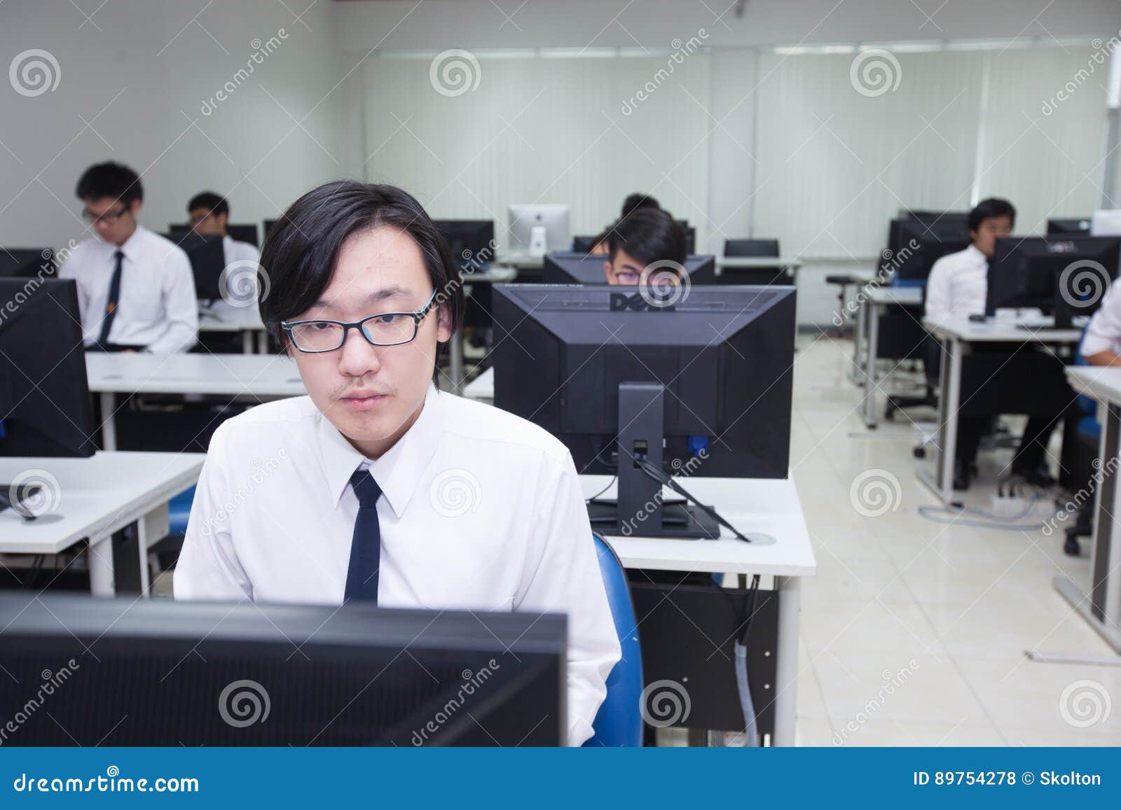 A Class of Students in Front of Their Screens Study Computer Science ...