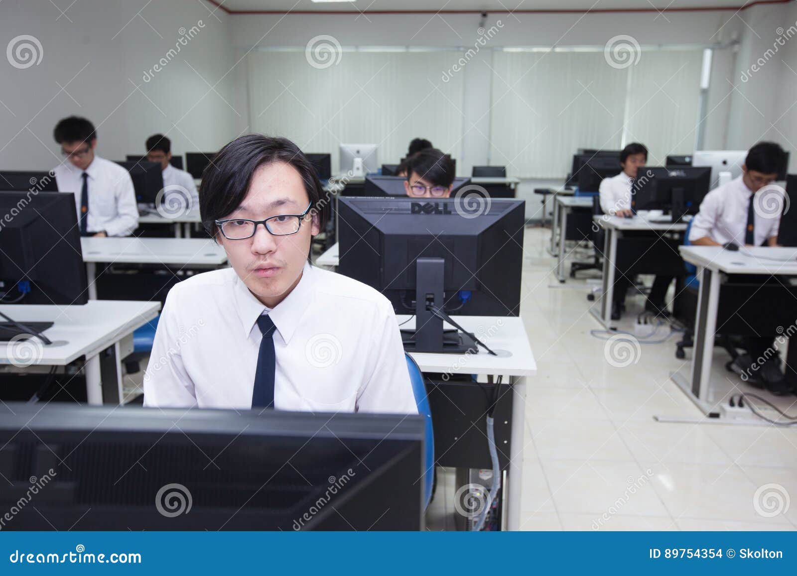 A Class of Students in Front of Their Screens Study Computer Science ...
