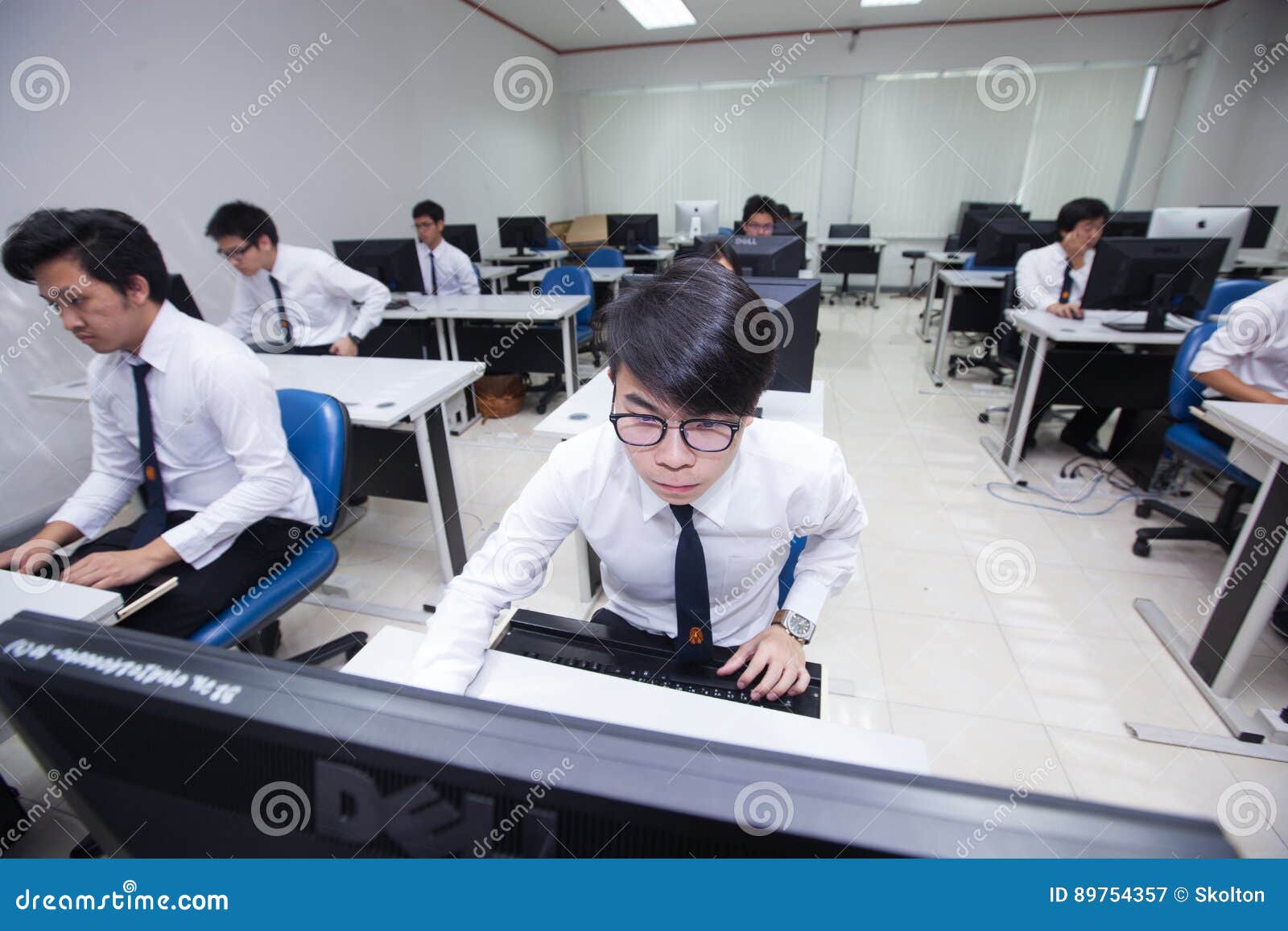A Class of Students in Front of Their Screens Study Computer Science ...