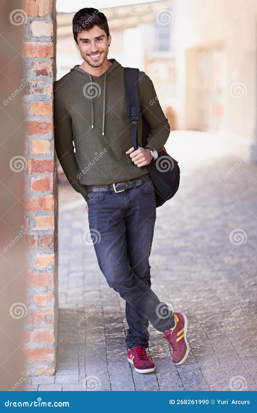 Between Classes...Cropped Portrait of a Handsome Young Man Standing ...