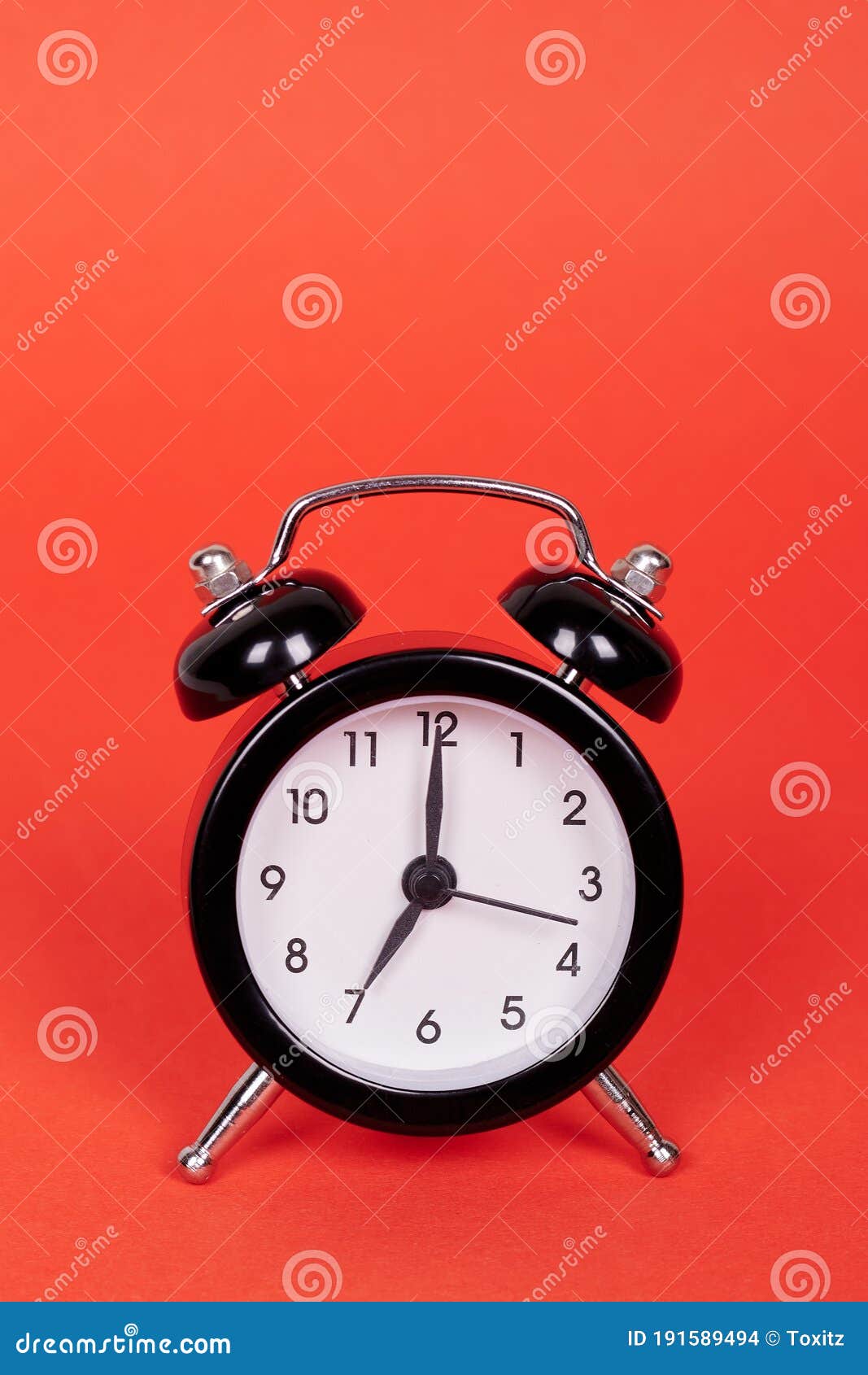 Classic Analog Clock with Bells. Isolated on Red Background. Copy Space ... Classic Analog Clock with Bells. Isolated on Red Background. Copy Space ...