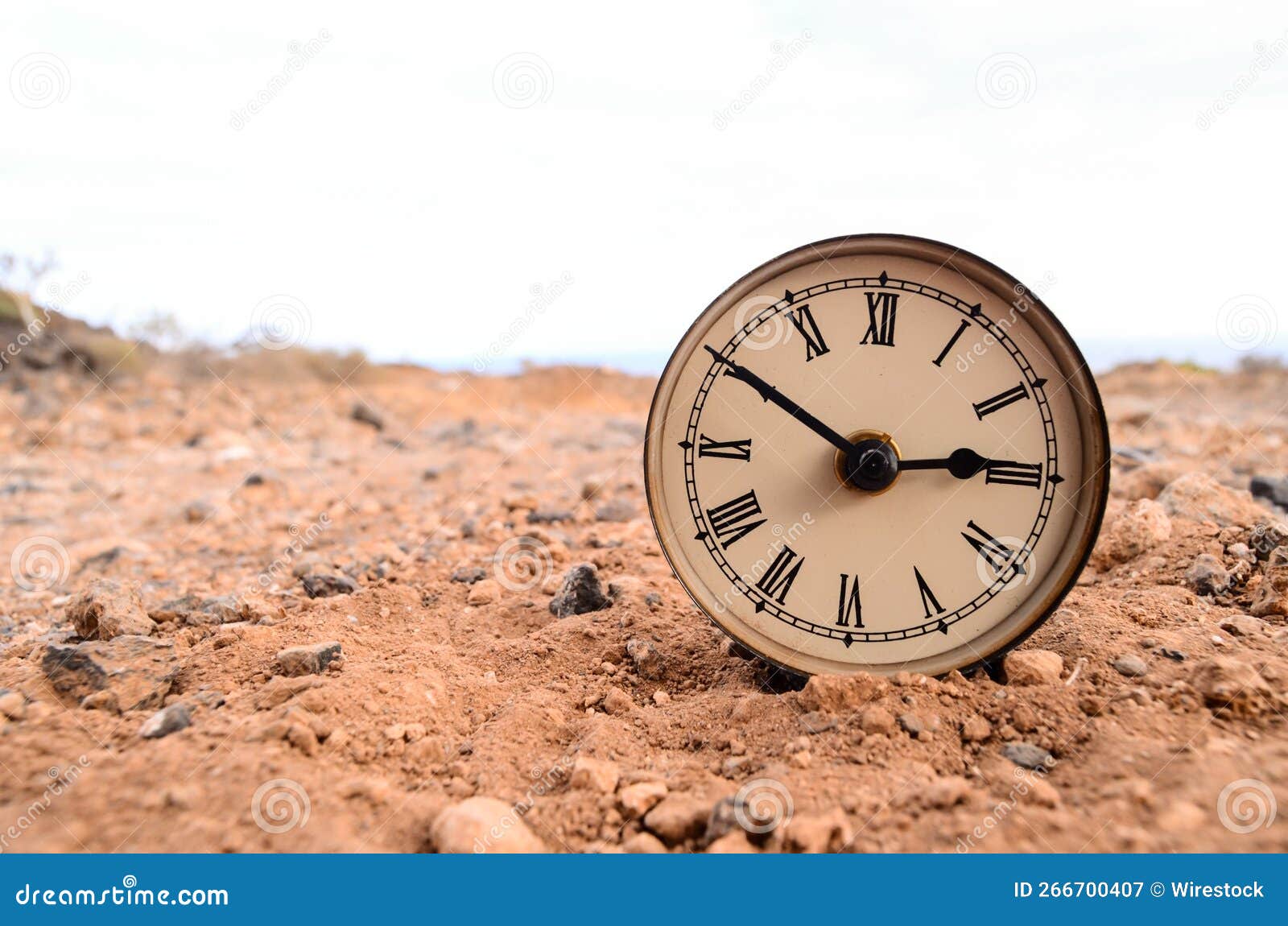 Classic Analog Clock on Sand Stock Image - Image of symbol, sign: 266700407