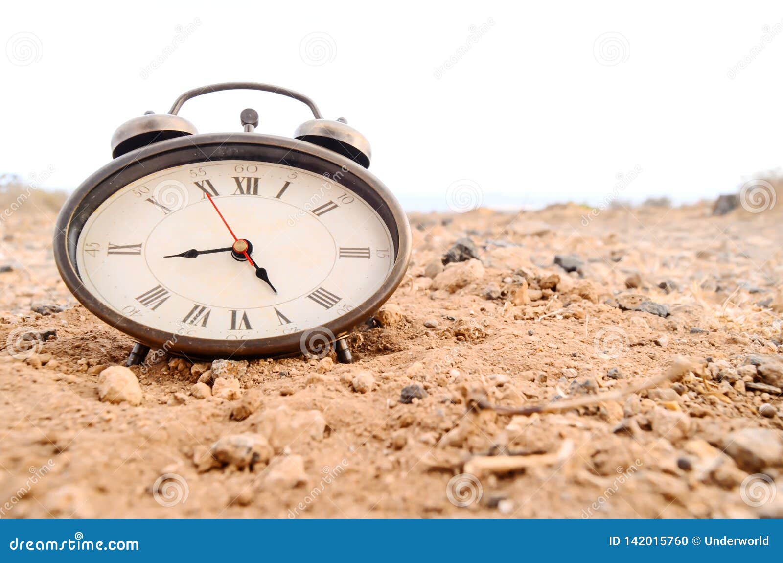 Classic Analog Clock in the Sand Stock Photo - Image of destinations ...