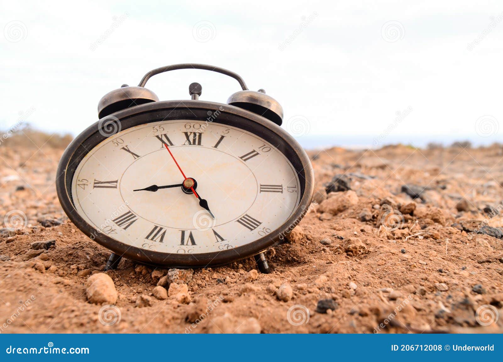 Classic Analog Clock in the Sand Stock Photo - Image of object ...
