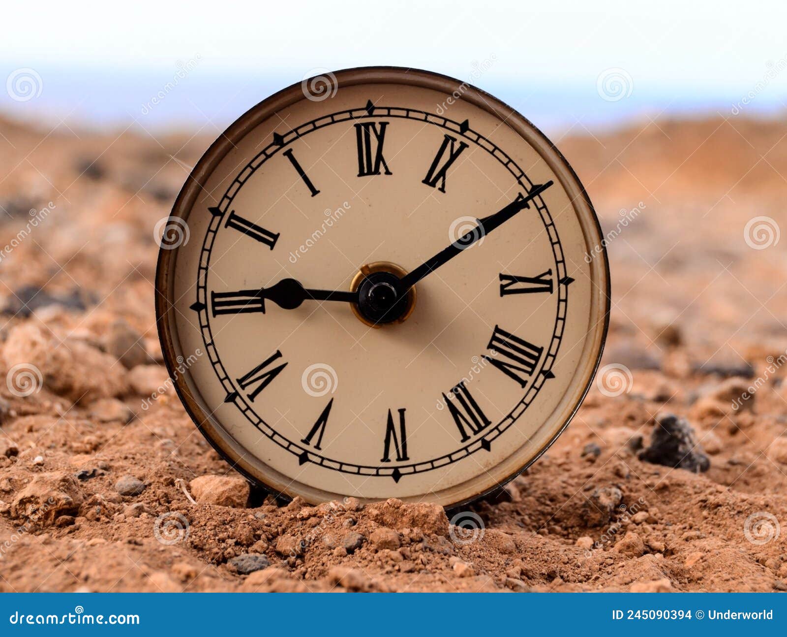 Classic Analog Clock in the Sand Stock Photo - Image of summer ...