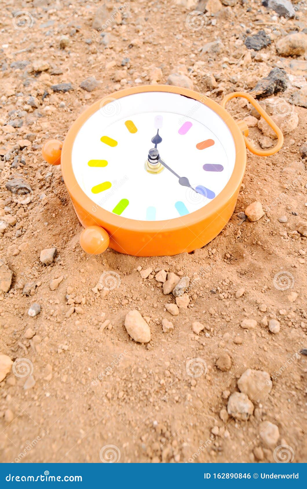 Classic Analog Clock in the Sand Stock Photo - Image of lost ...