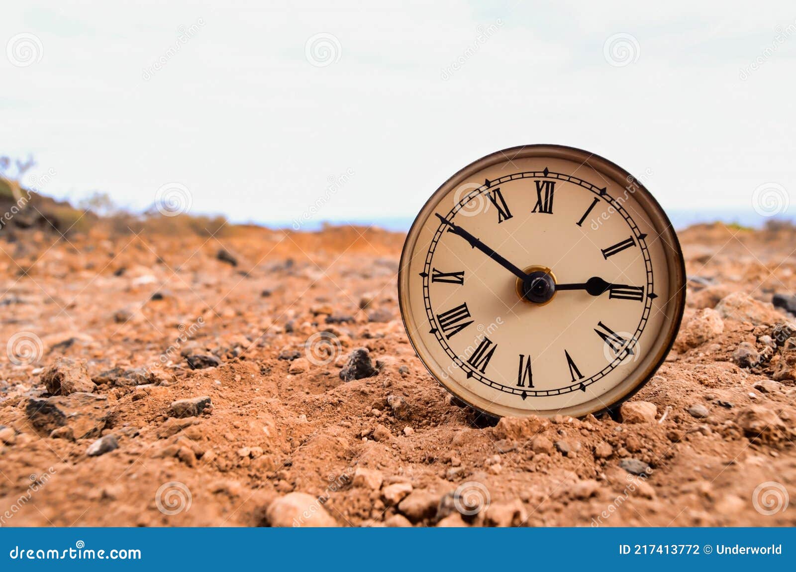 Classic Analog Clock in the Sand Stock Photo - Image of closeup ...