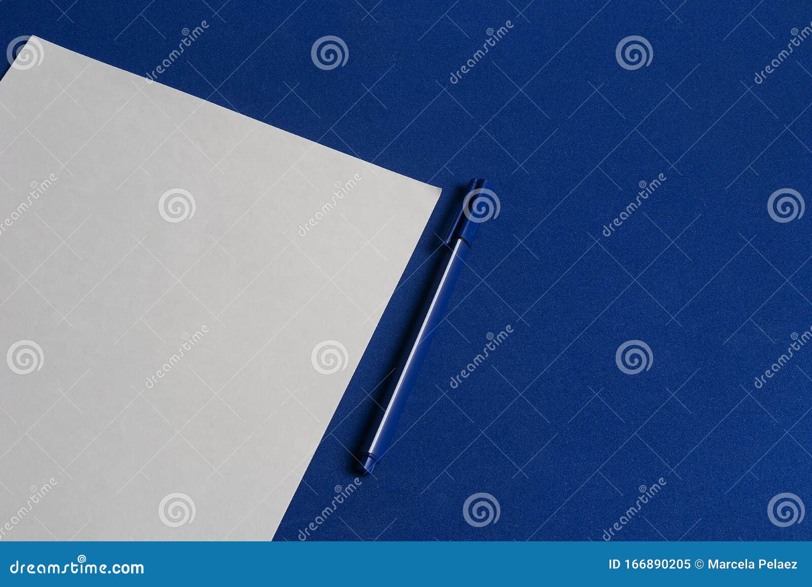 Classic Blue Table with Blank Sheet of Paper and Blue Pen Ready for ...