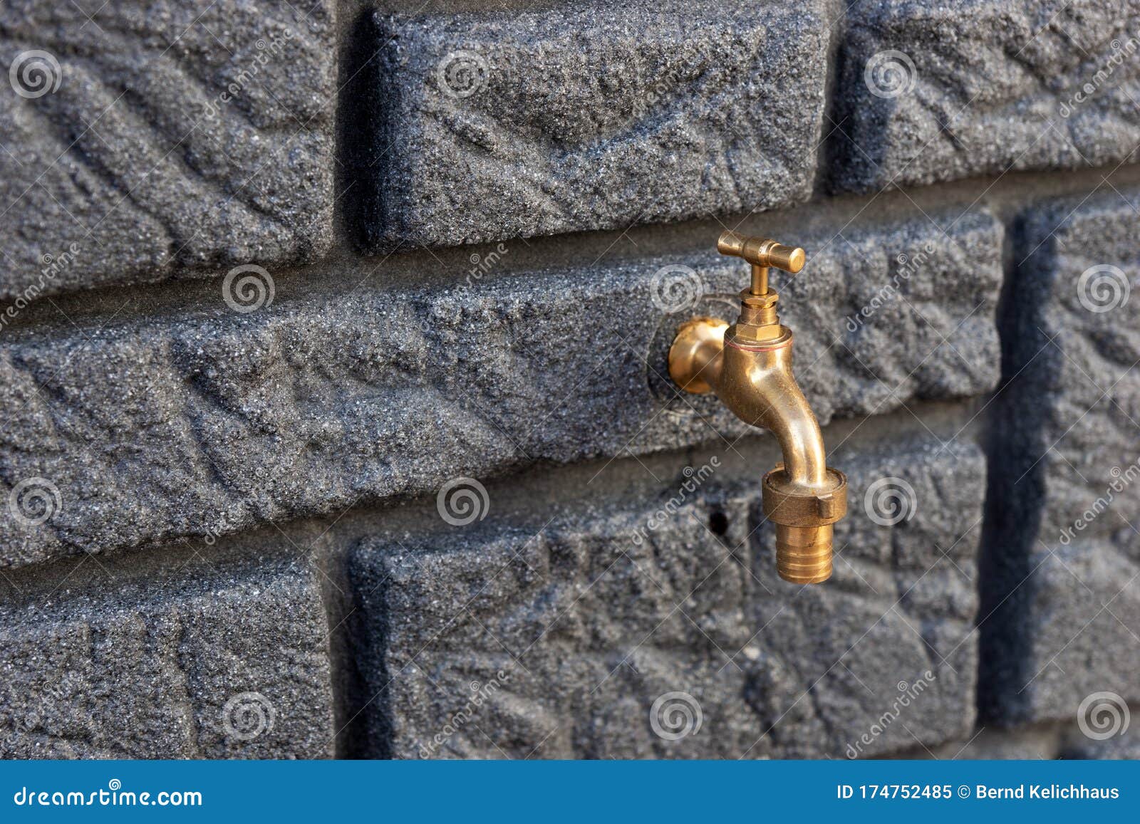 Classic Brass Faucet on the Dark Gray Stone Wall Stock Image - Image of ...