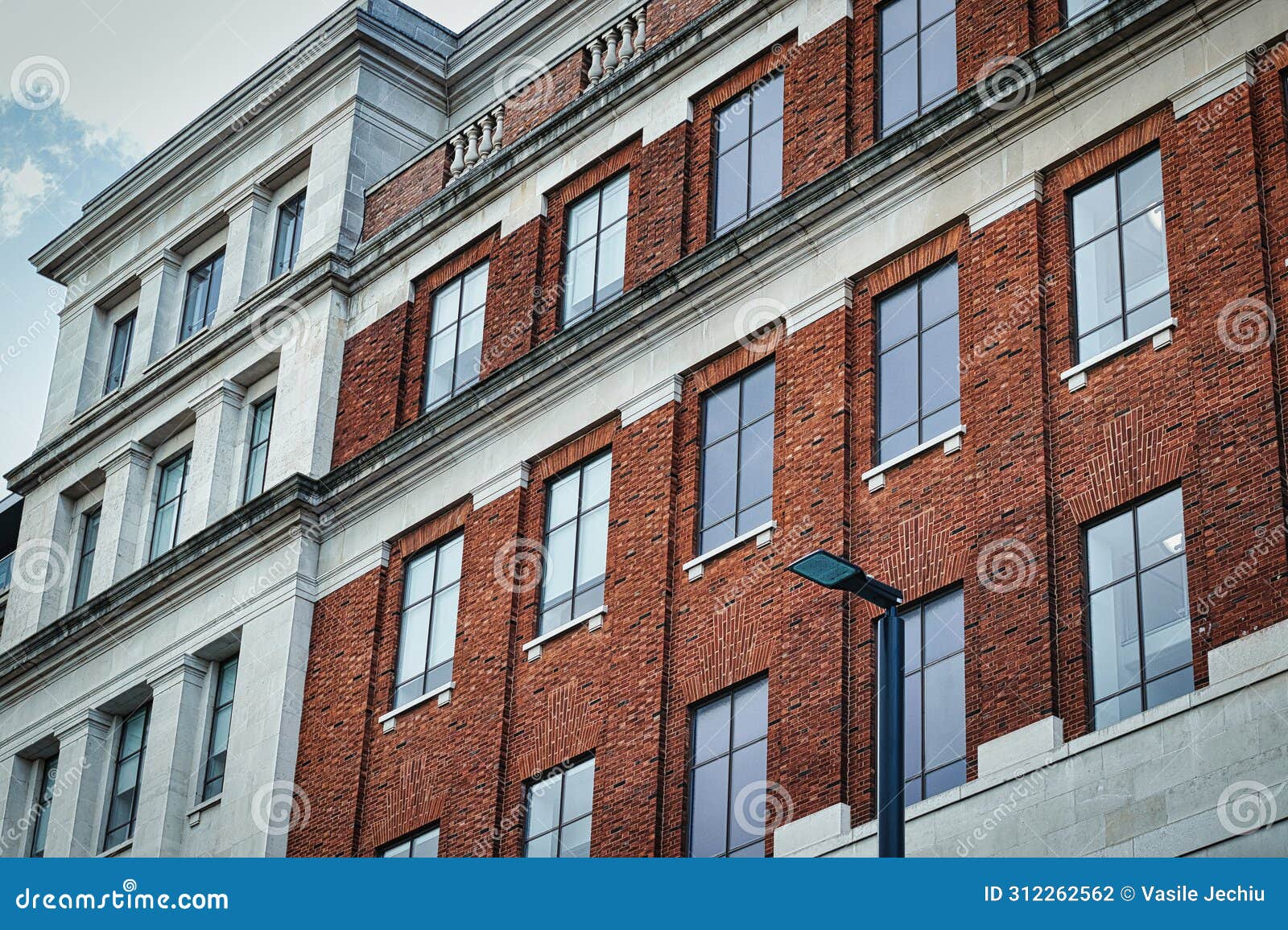 Classic Brick Building Facade with Large Windows and Decorative ...