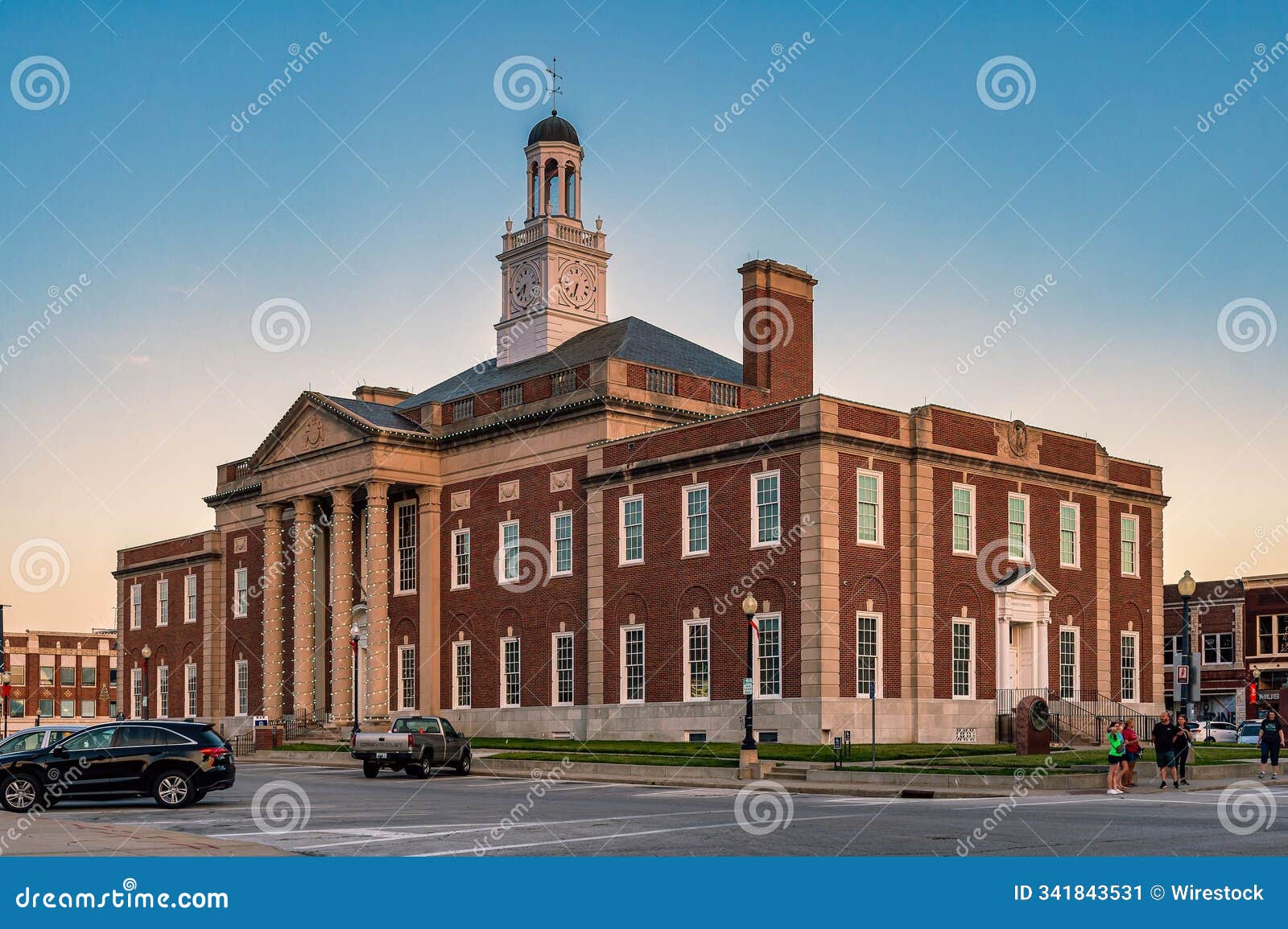 Classic Brick Courthouse Building with a Clock Tower at Sunset in a ...