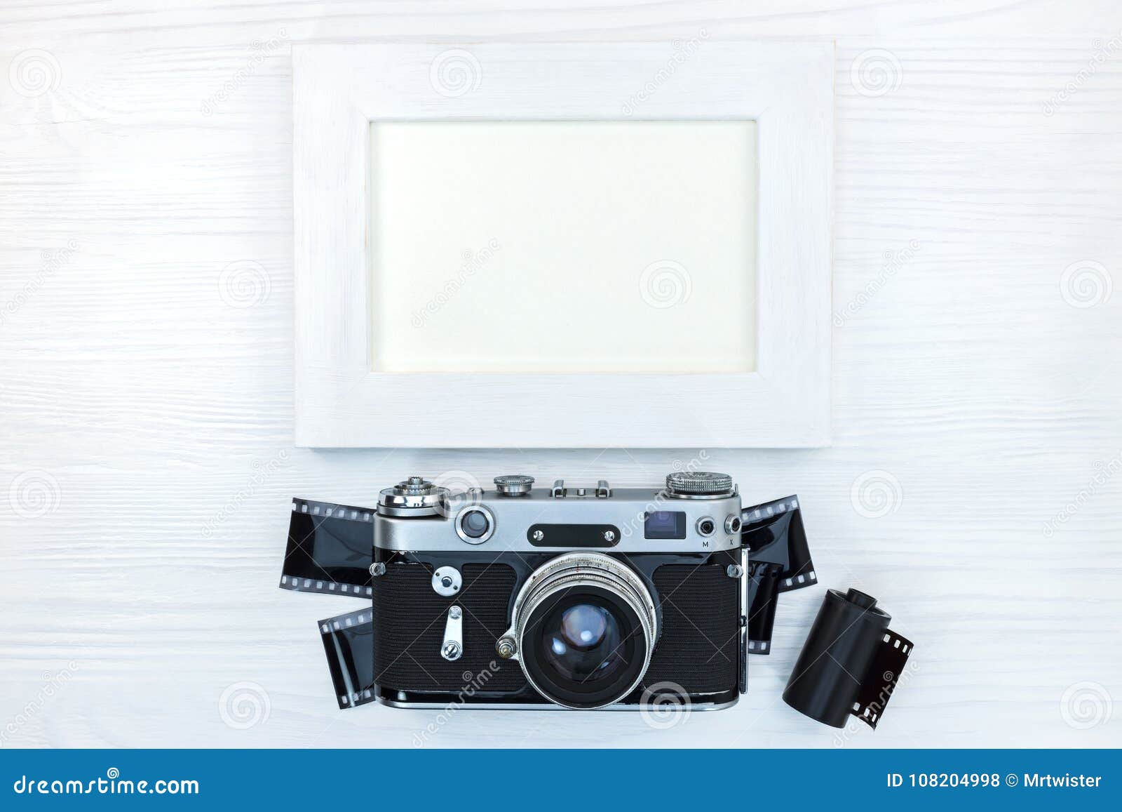 Classic Camera with Negative Films and Empty Photo Frame on Whit Stock ...