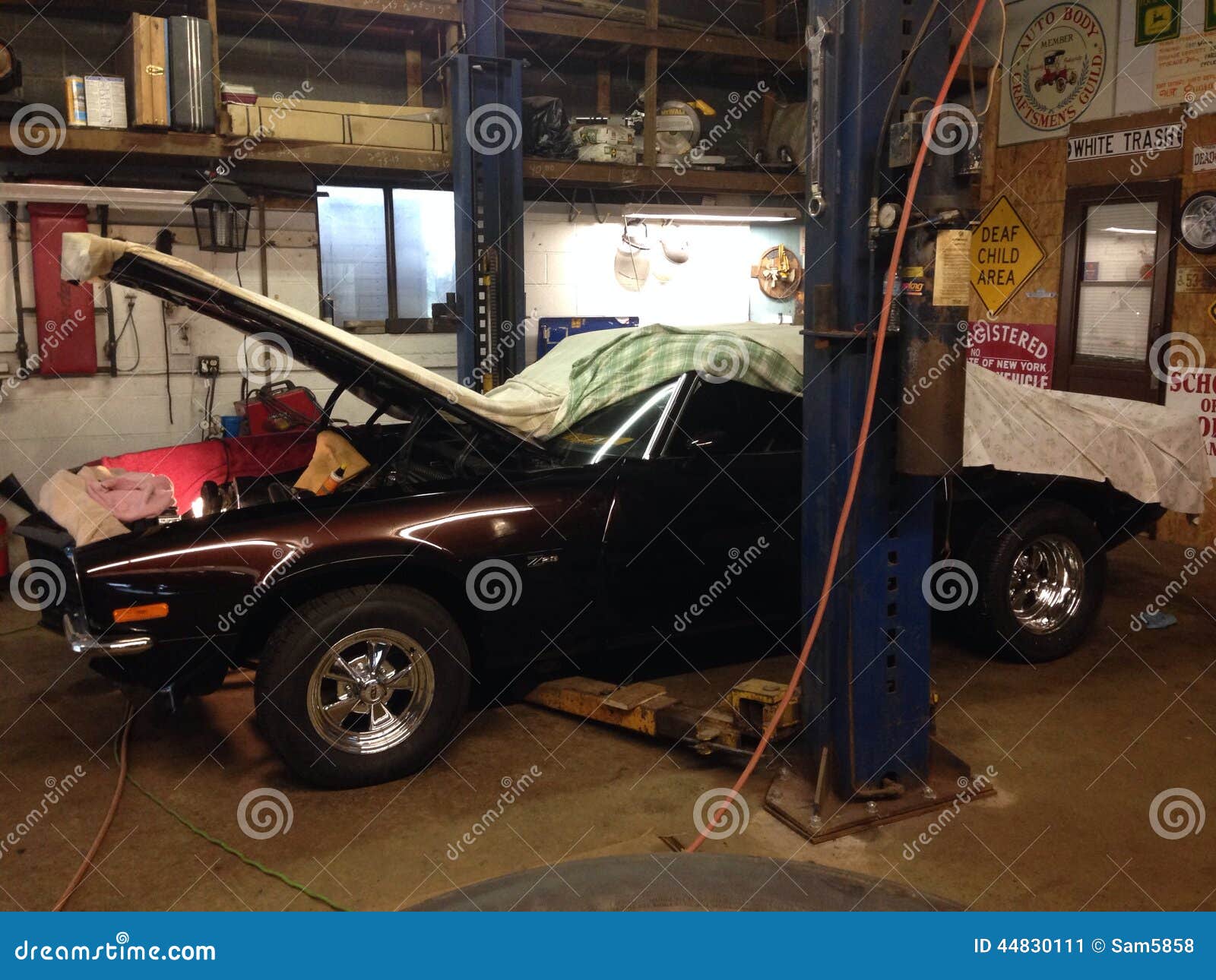 Classic Car Being Fixed Editorial Photo | CartoonDealer.com #44830111