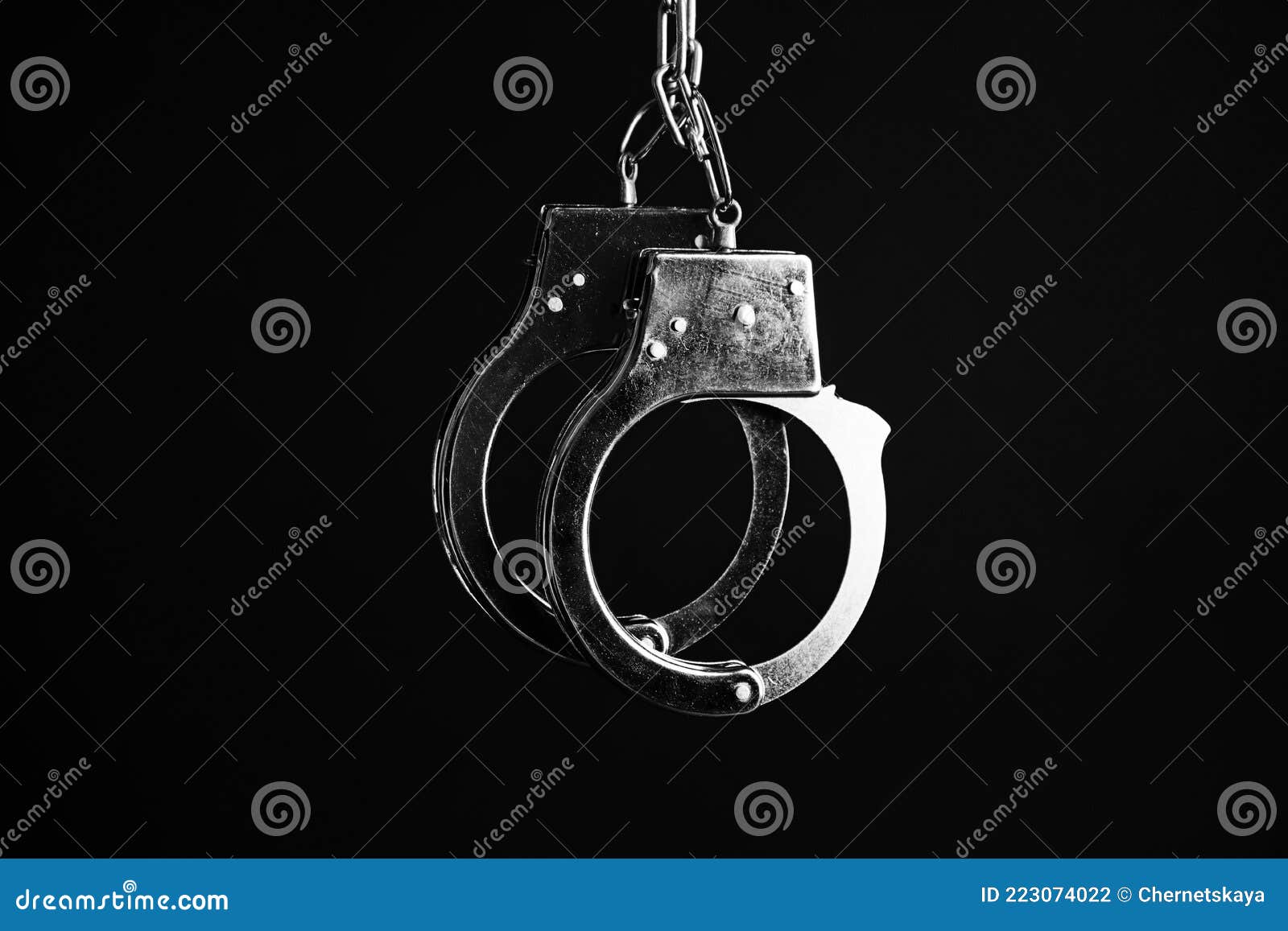 Classic Chain Handcuffs Hanging on Black Background Stock Photo - Image ...