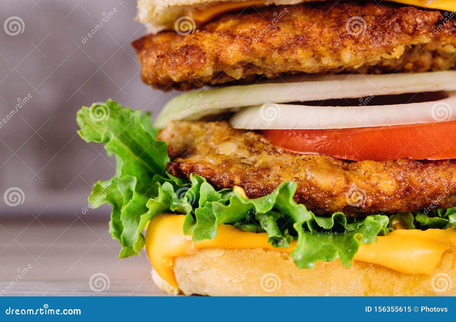 Classic Cheeseburger with Lettuce, Onions, Tomato and Meat Stock Image ...