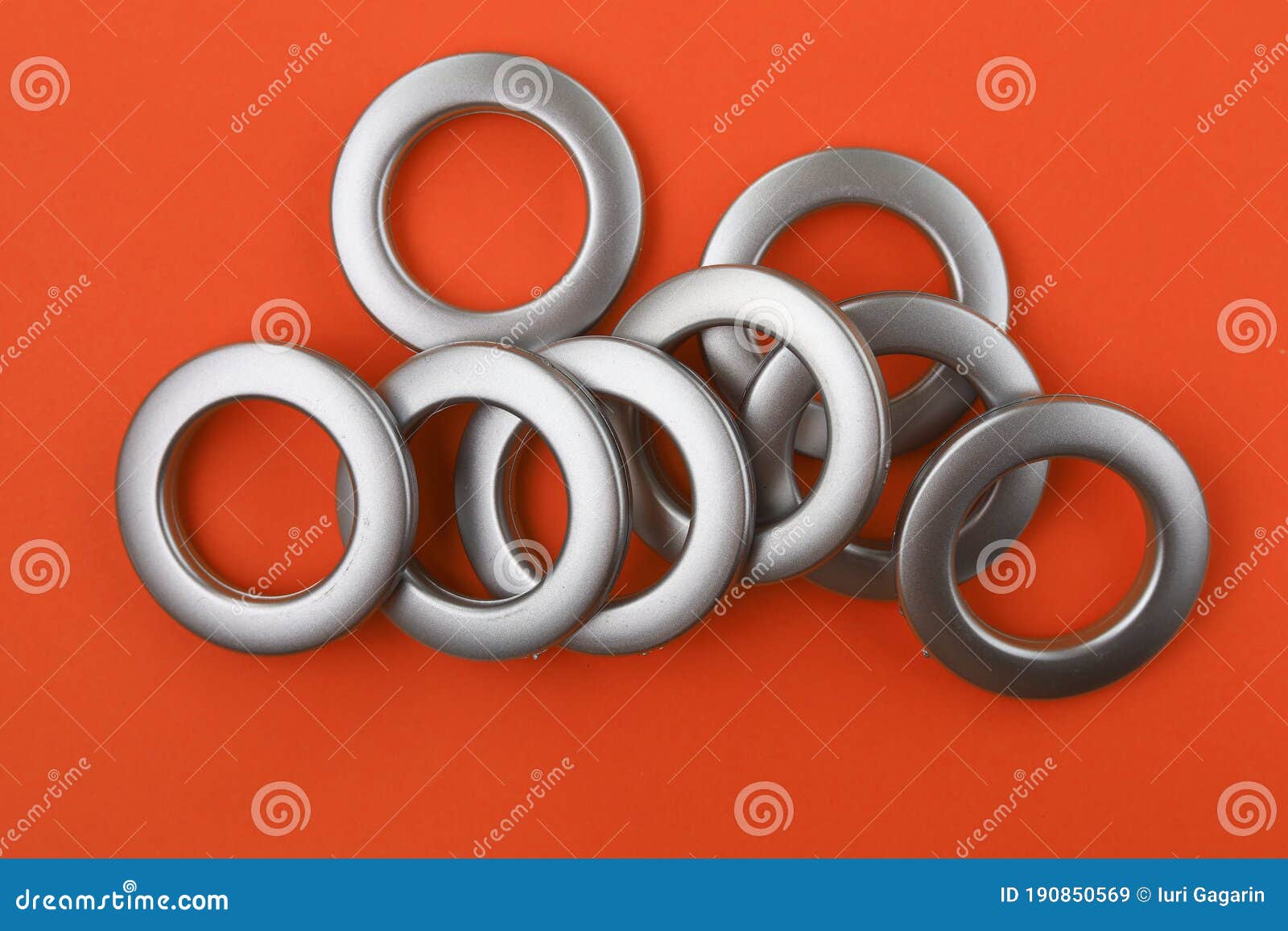 Classic Chrome Eyelets for Curtains on an Orange Background Stock Image ...