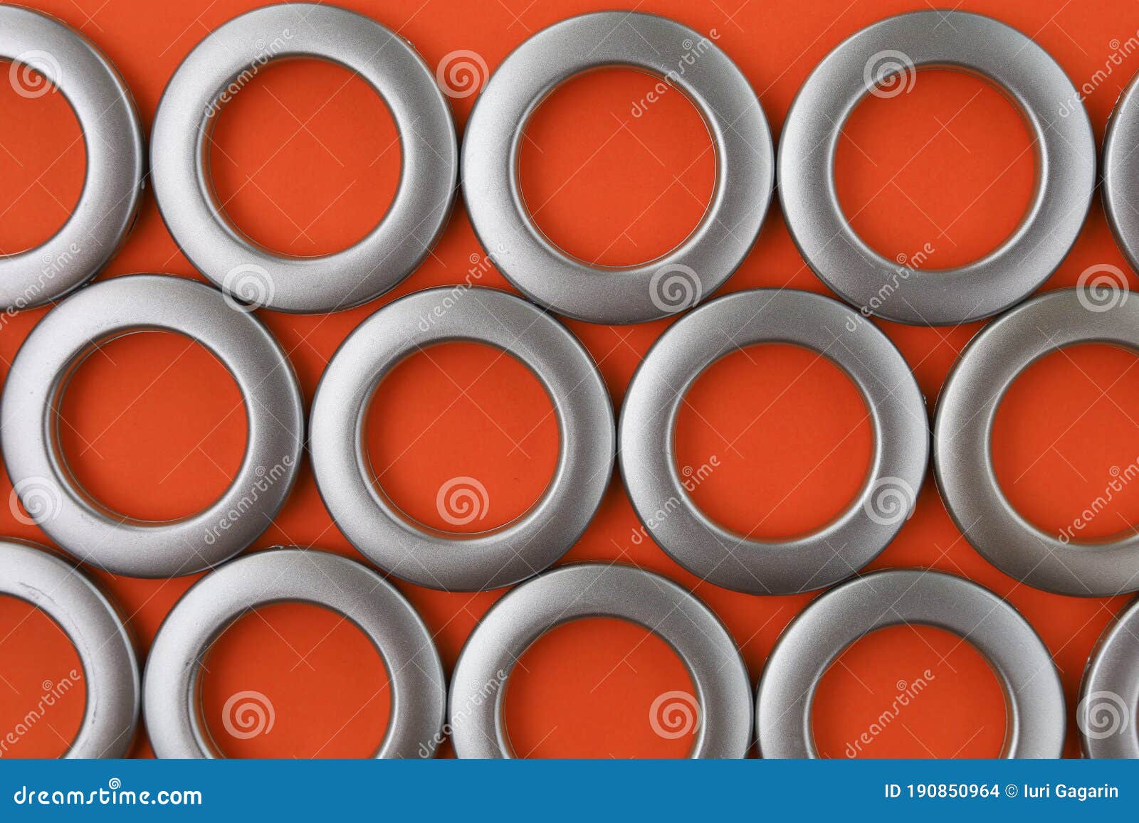 Classic Chrome Eyelets for Curtains on an Orange Background Stock Photo ...