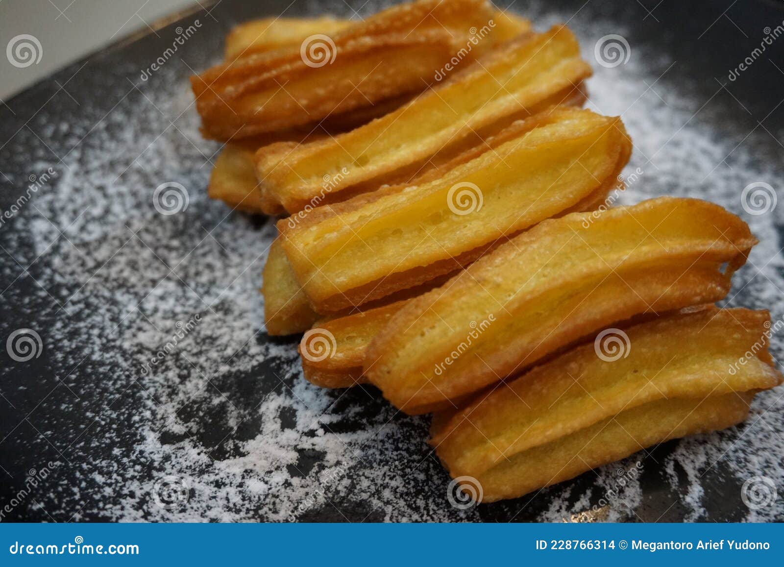 Classic Churros with Ice Sugar on Black Plate Stock Photo - Image of ...