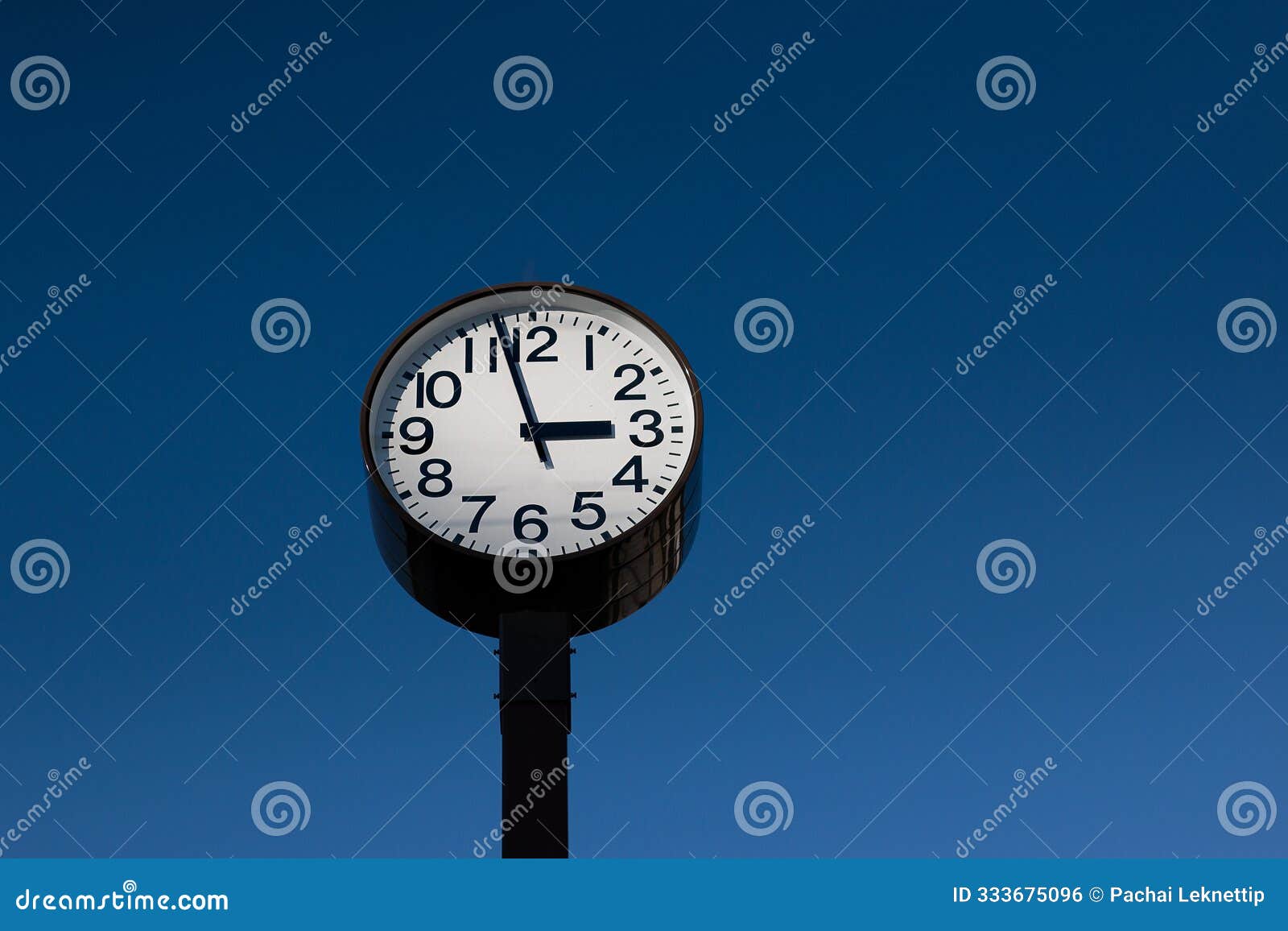 Classic Clock Tower Against Clear Blue Sky at Noon Stock Photo - Image ...