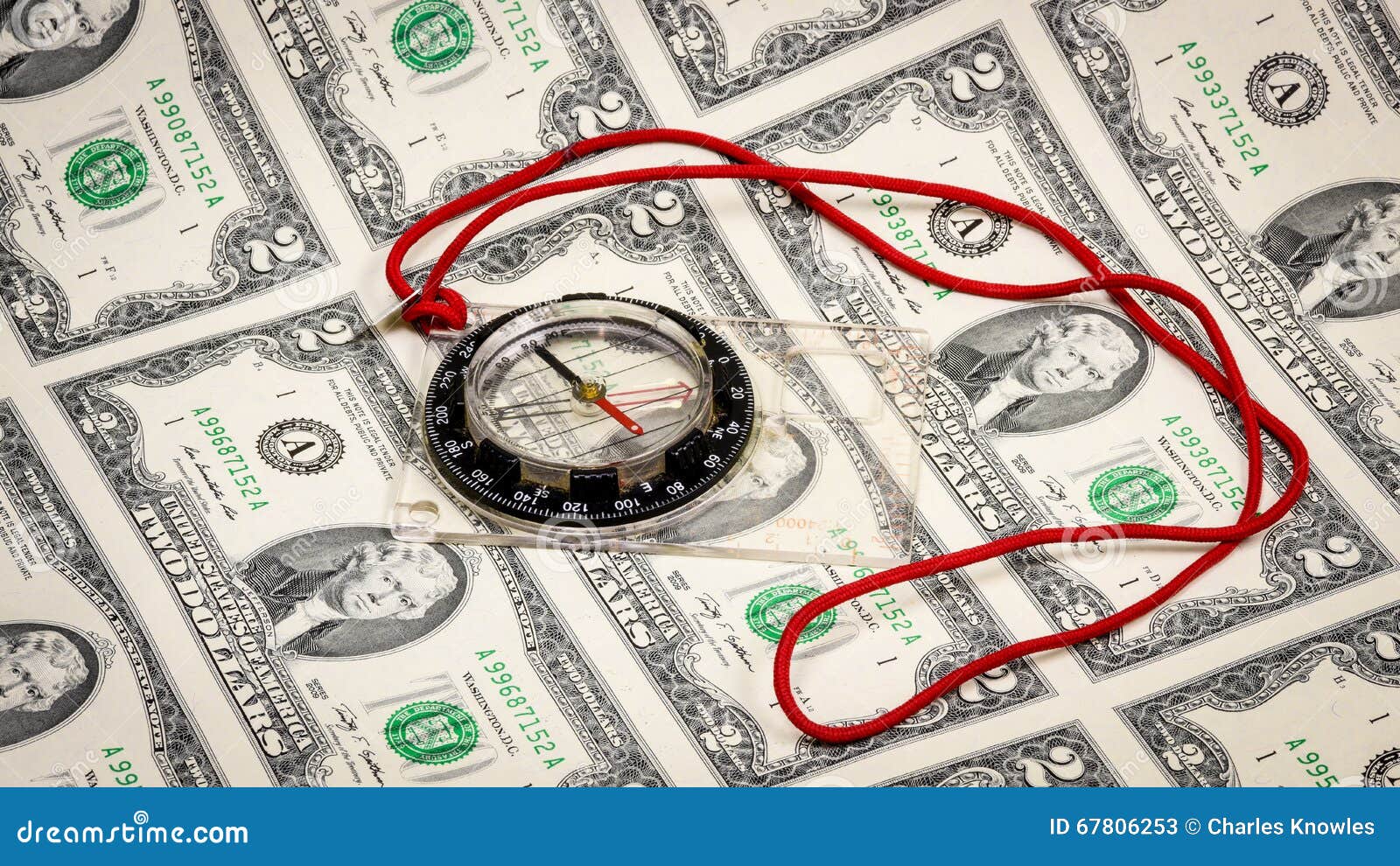 Classic Compas with a Red String on Green Dollars Stock Image - Image ...