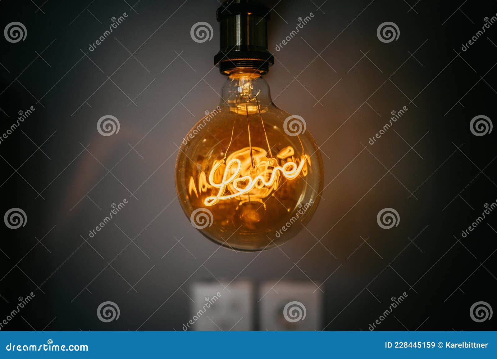 A Classic Edison Light Bulb on Black Background with Space for Text ...