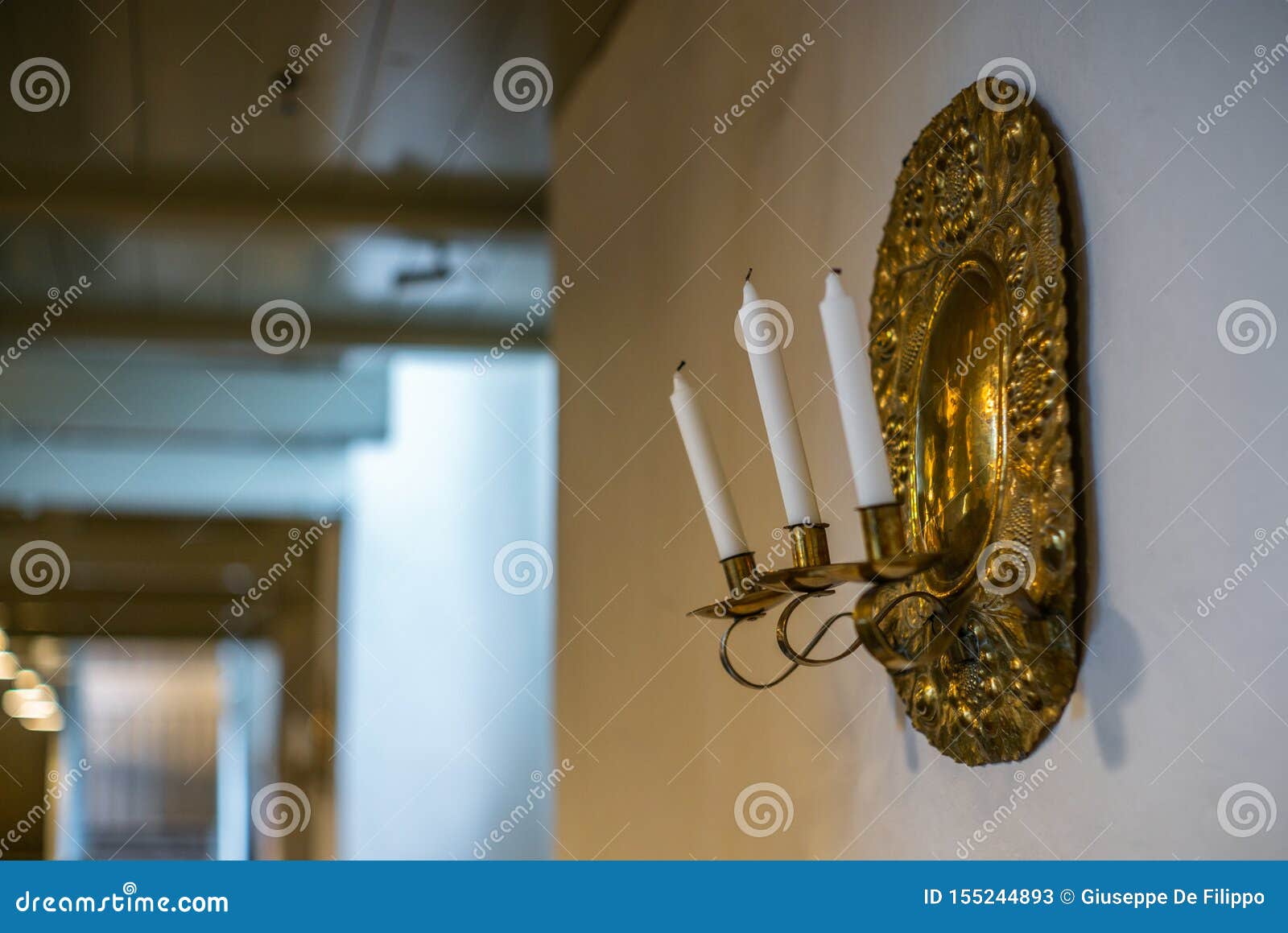 A Classic Elegant Chandelier with Candles on a Wall in Scandinavia ...