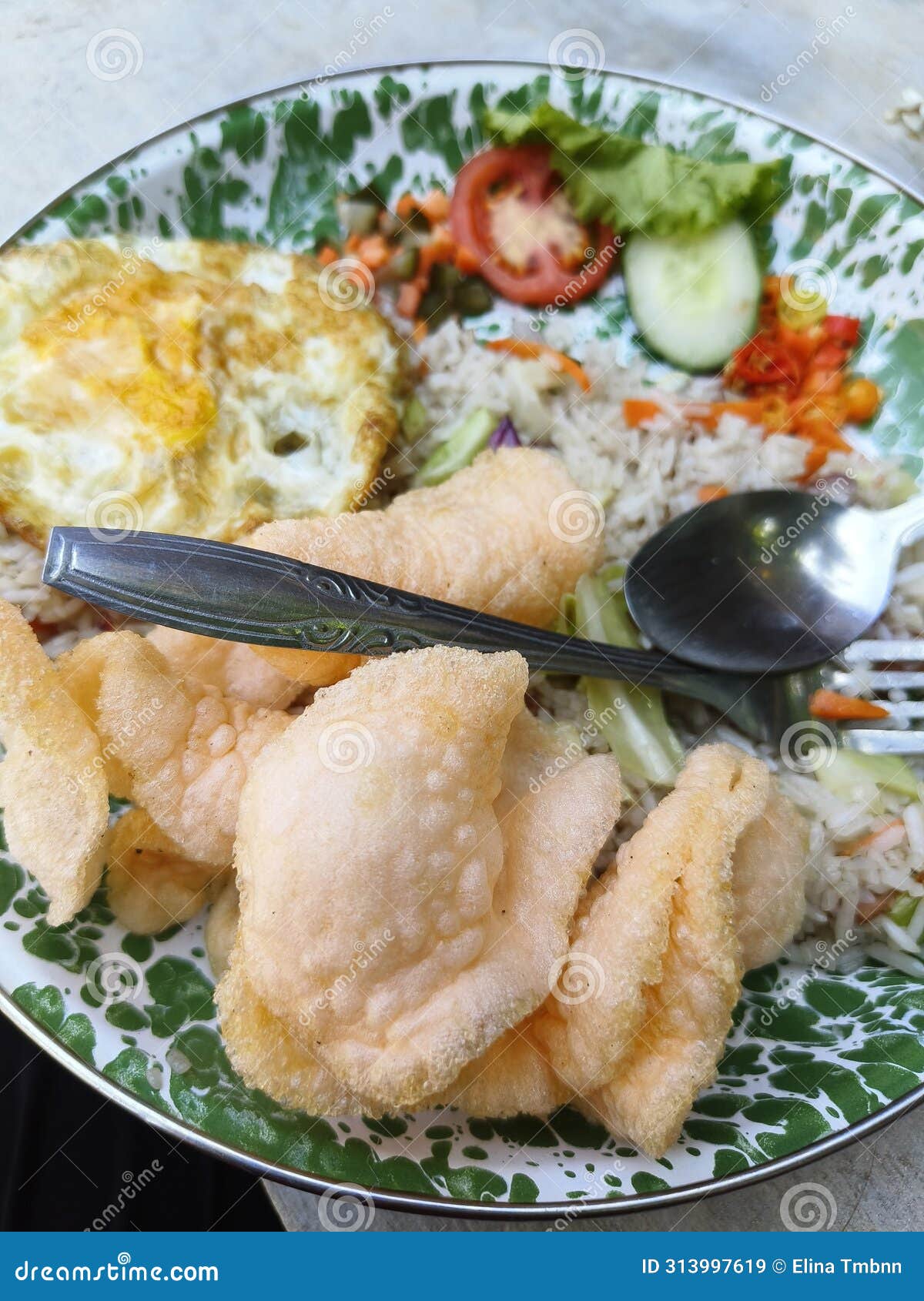 Classic Fried Rice with Fried Egg, Crisps, and Pickles Stock Image ...