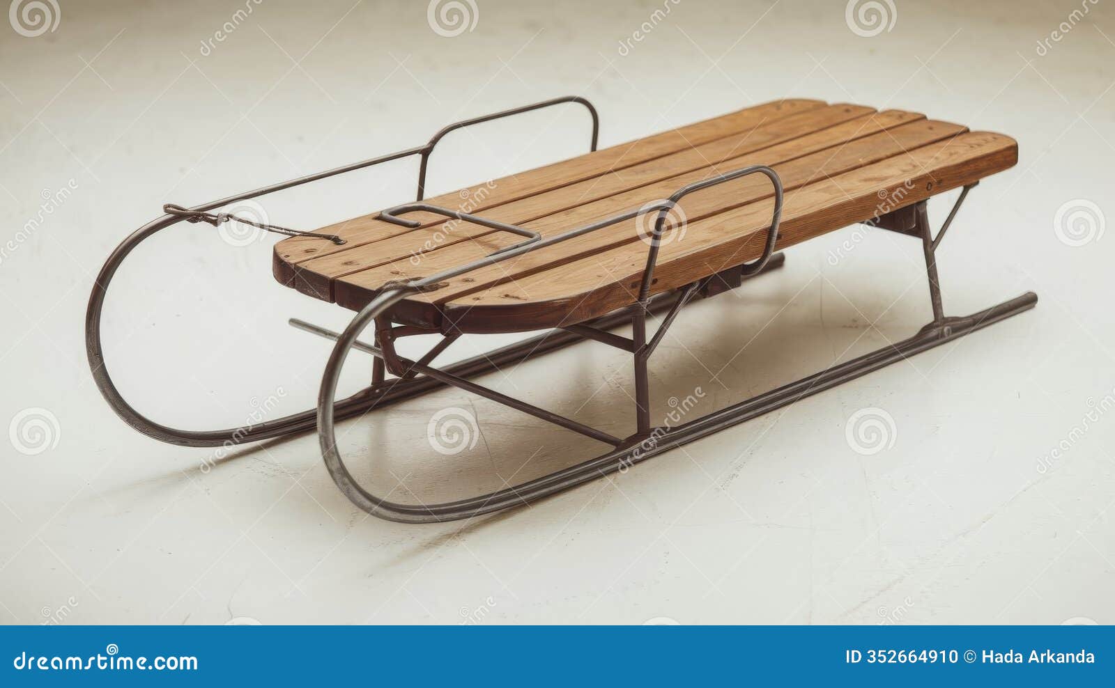 Classic Kids Sled with Metal Runners, Resting on a White Surface Stock ...