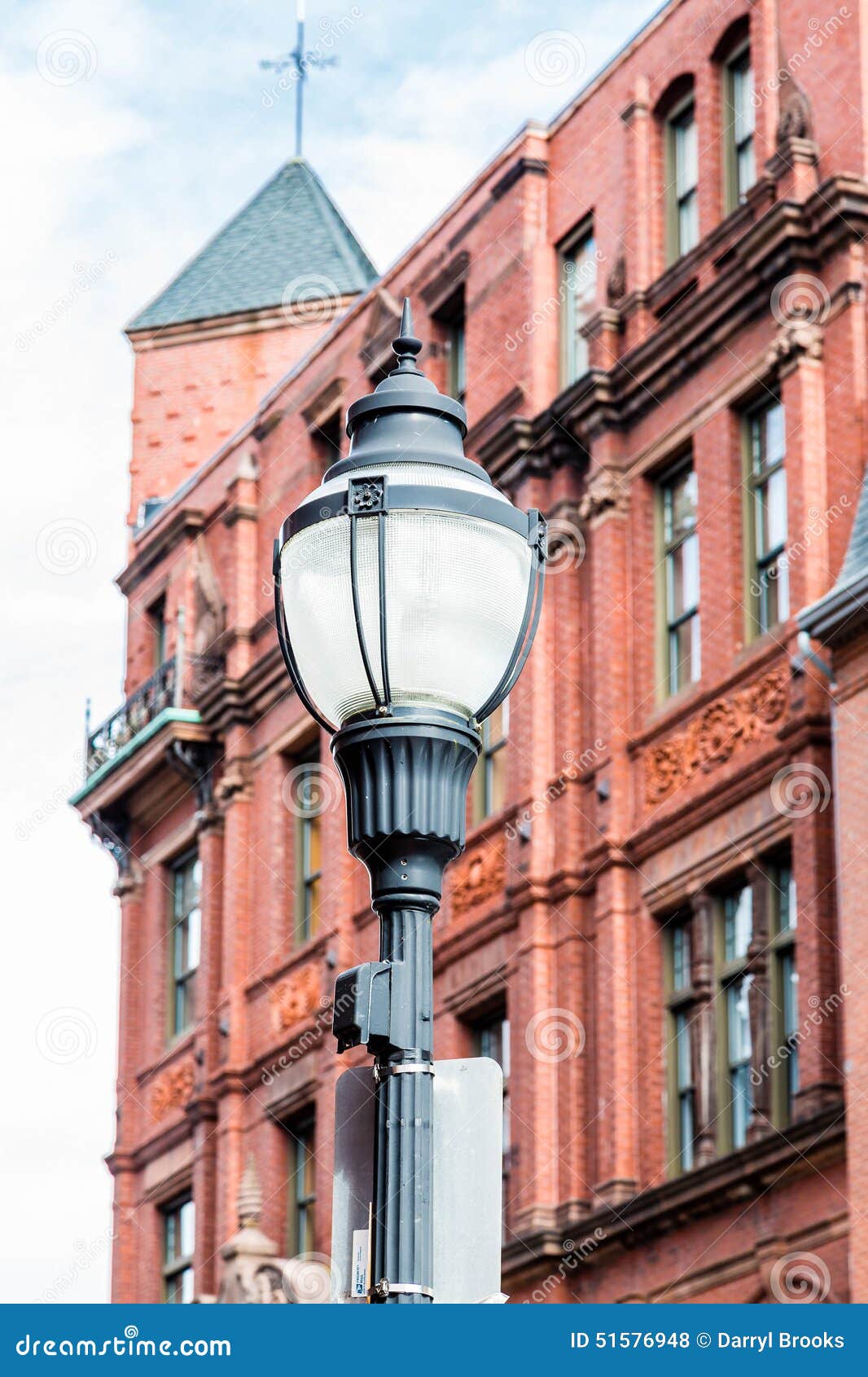 Classic Old Lamp Post by Brick Building Stock Photo - Image of building ...