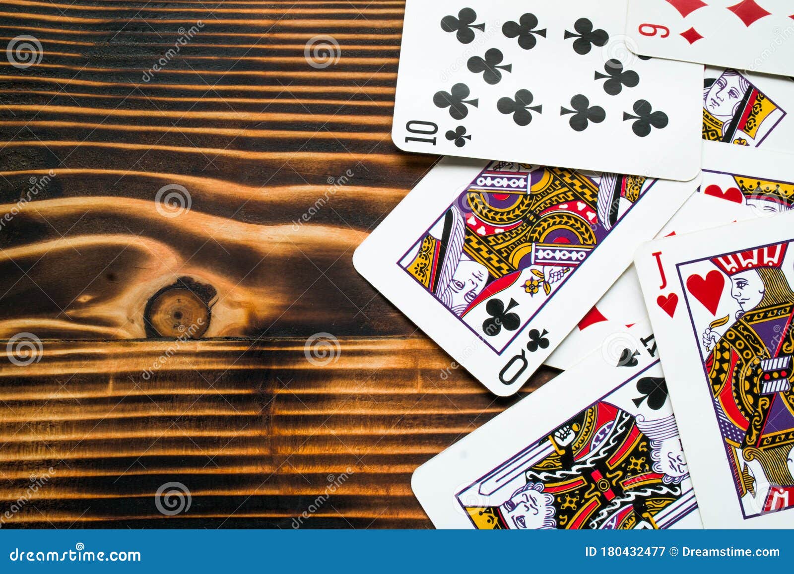 Classic Playing Cards on Dark Brown Wooden Table. Scattered Cards Stock ...