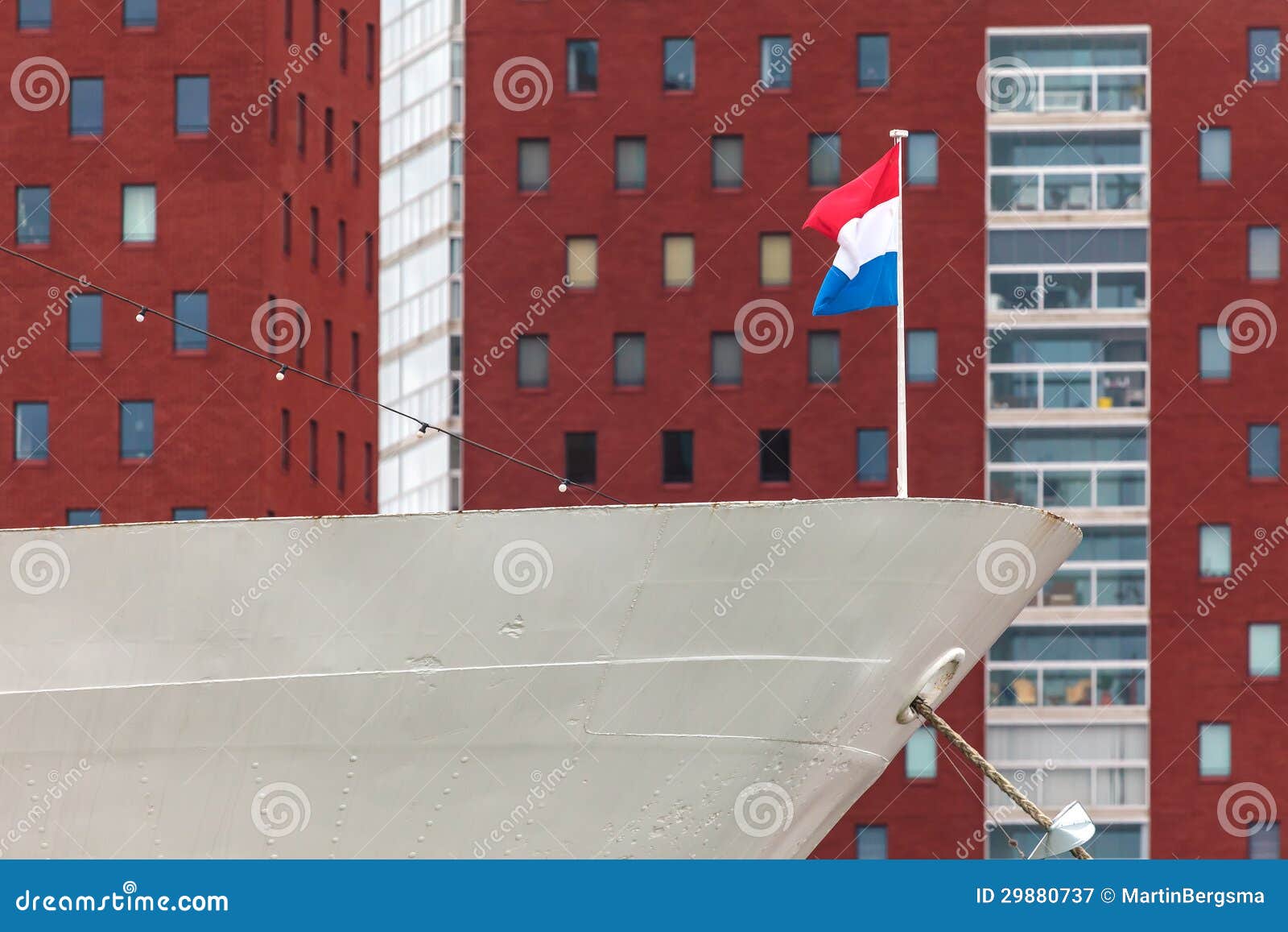 Classic Ship with Dutch Flag in Front of Modern Buildings Stock Image ...
