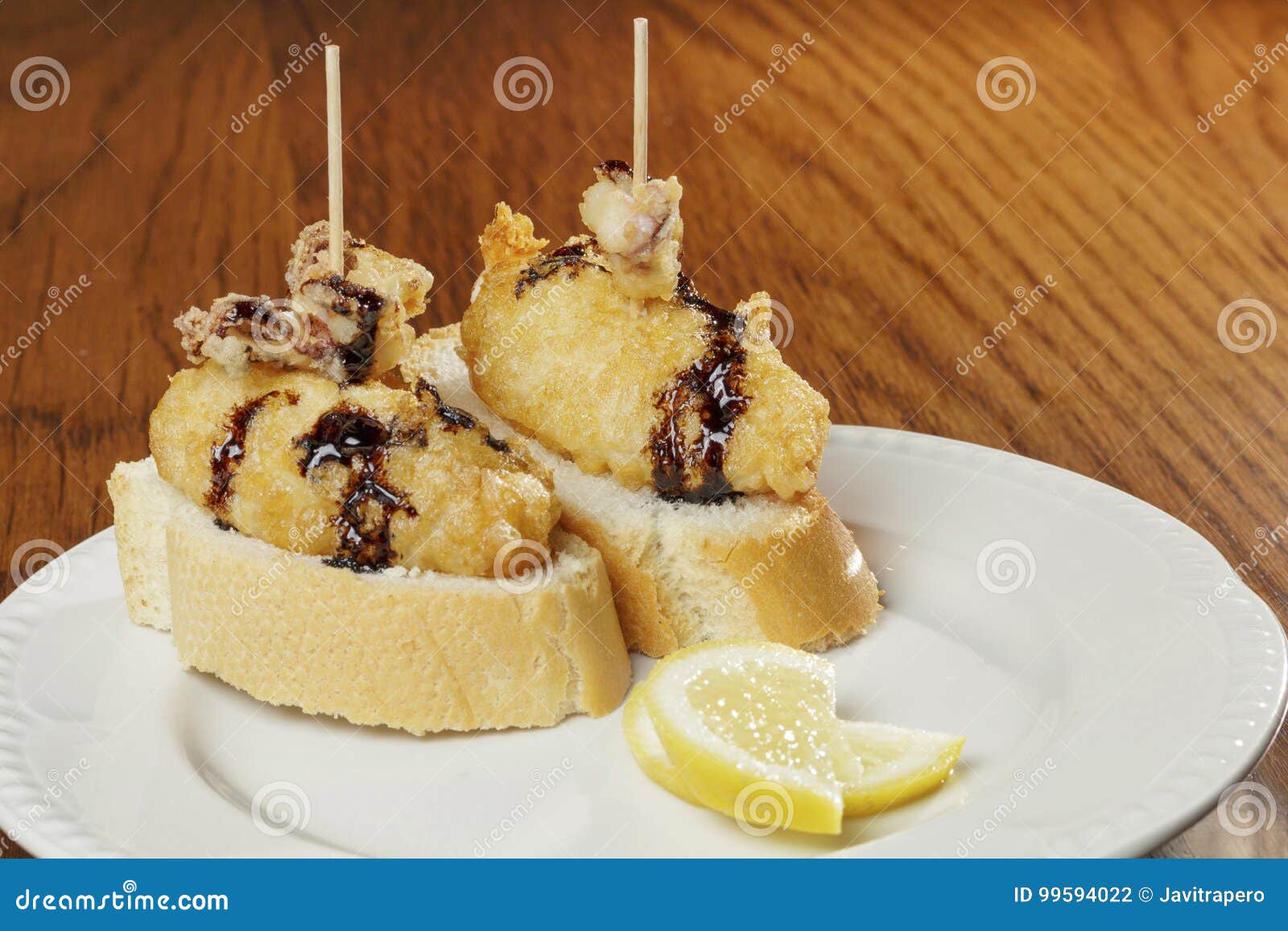 Classic Spanish Tapas: Two Fried Calamari Served on a Dish Stock Photo ...
