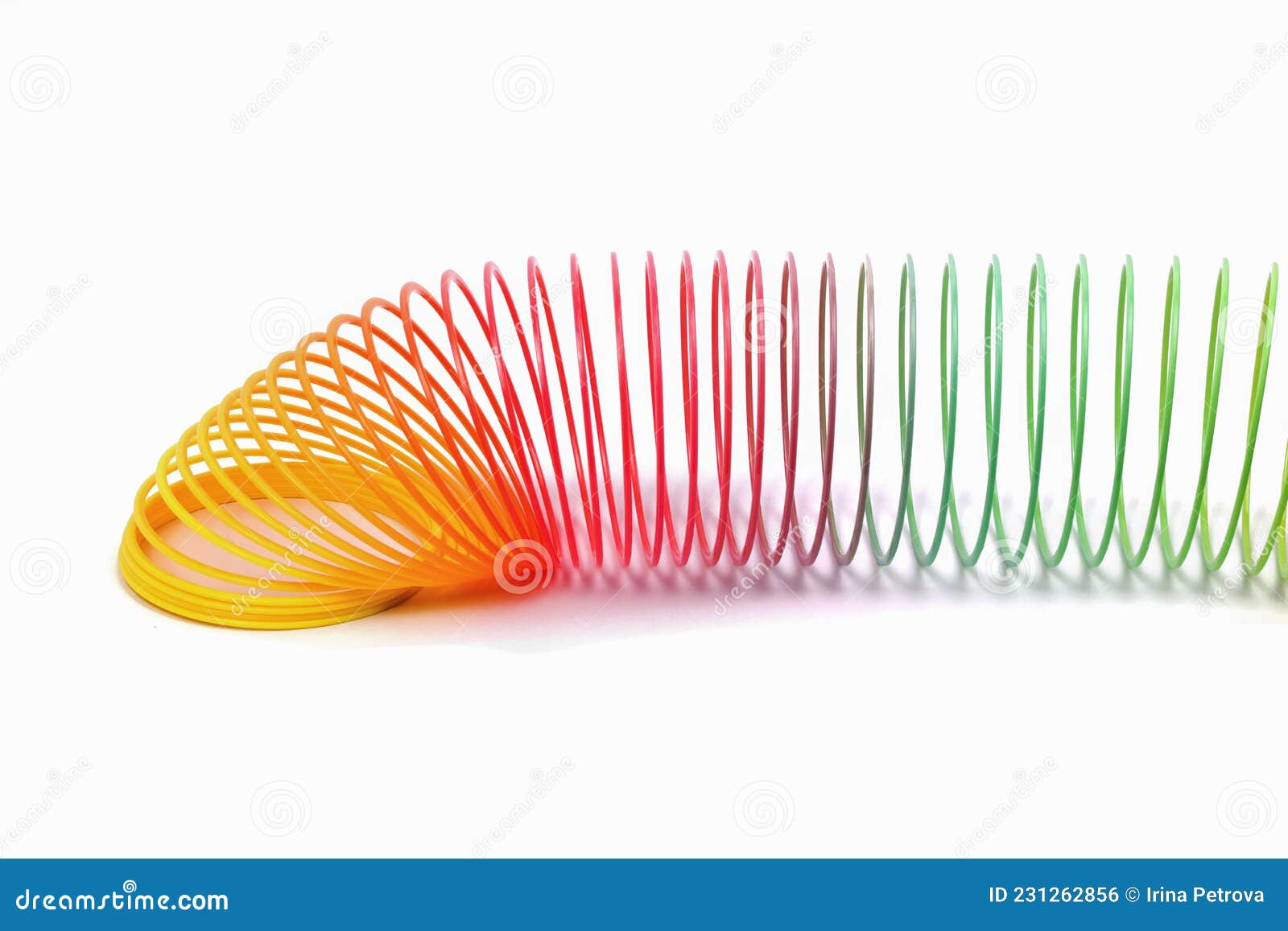 A Classic Spring Toy Stretched Out Lies on a White Background Editorial ...