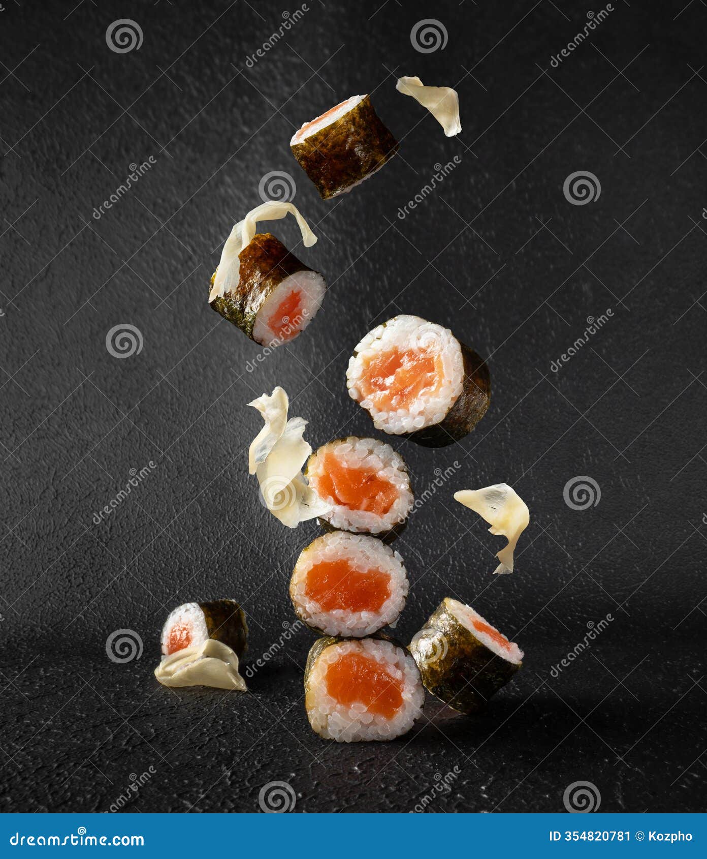 Classic Sushi Rolls with Ginger Falling Down on Black Background Stock ...
