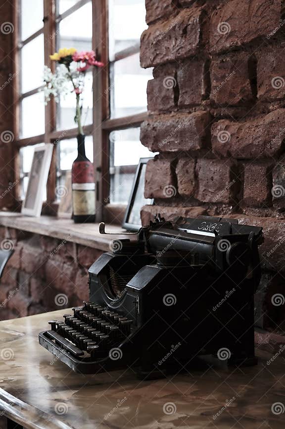 Classic Typewriter on a Wooden Table in Front of a Window Stock Image ...