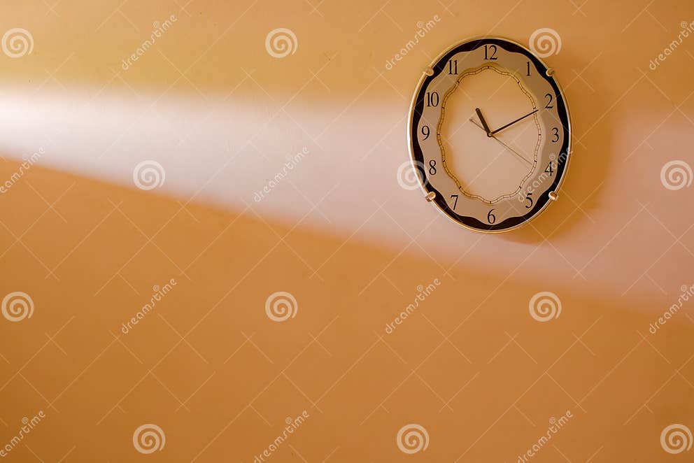 Classic Wall Clock on the Wall with Ray of Light Stock Photo - Image of ...