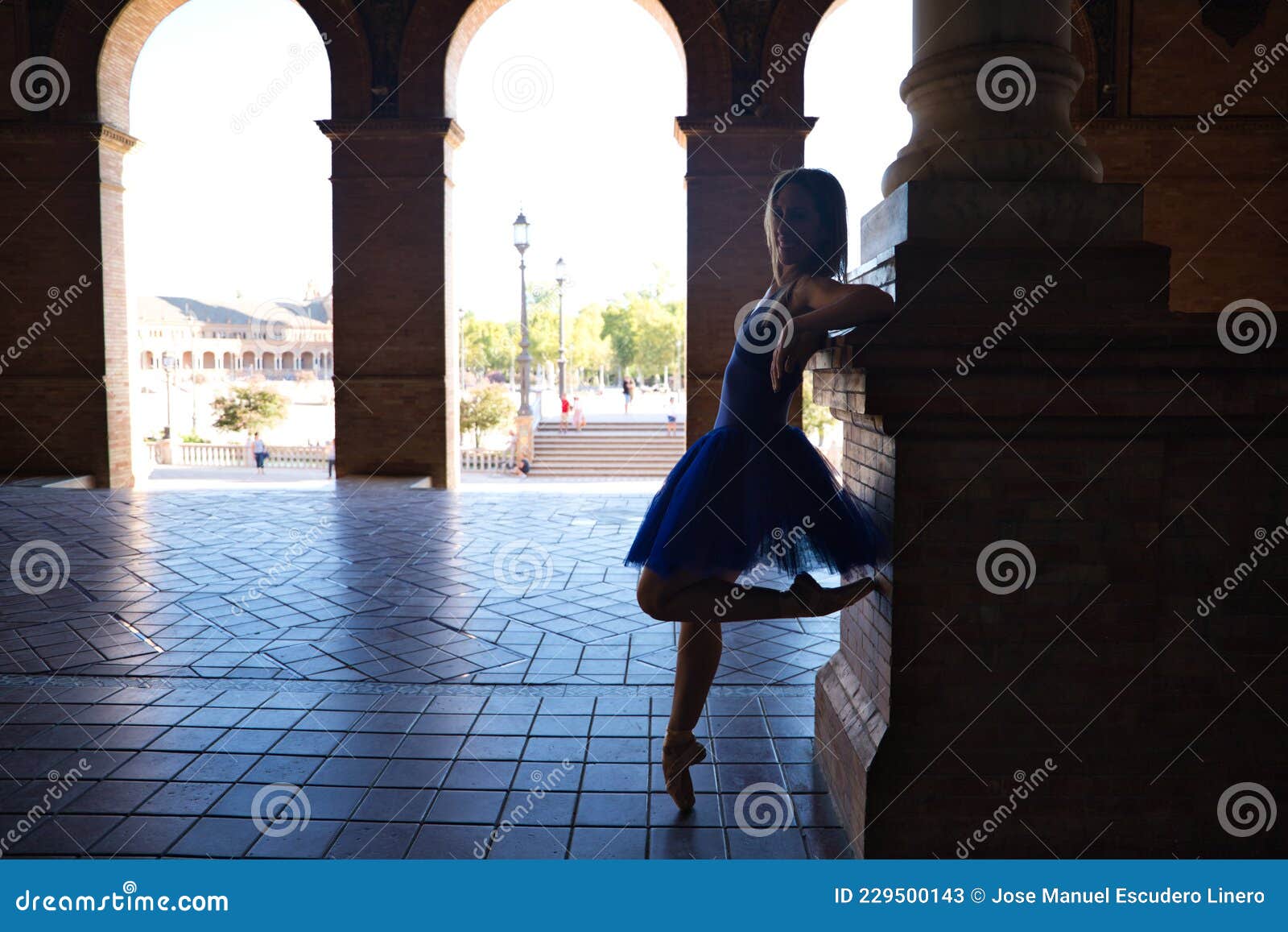 Classical Ballet Dancer Leans on Columns in the Park and Looking at the ...
