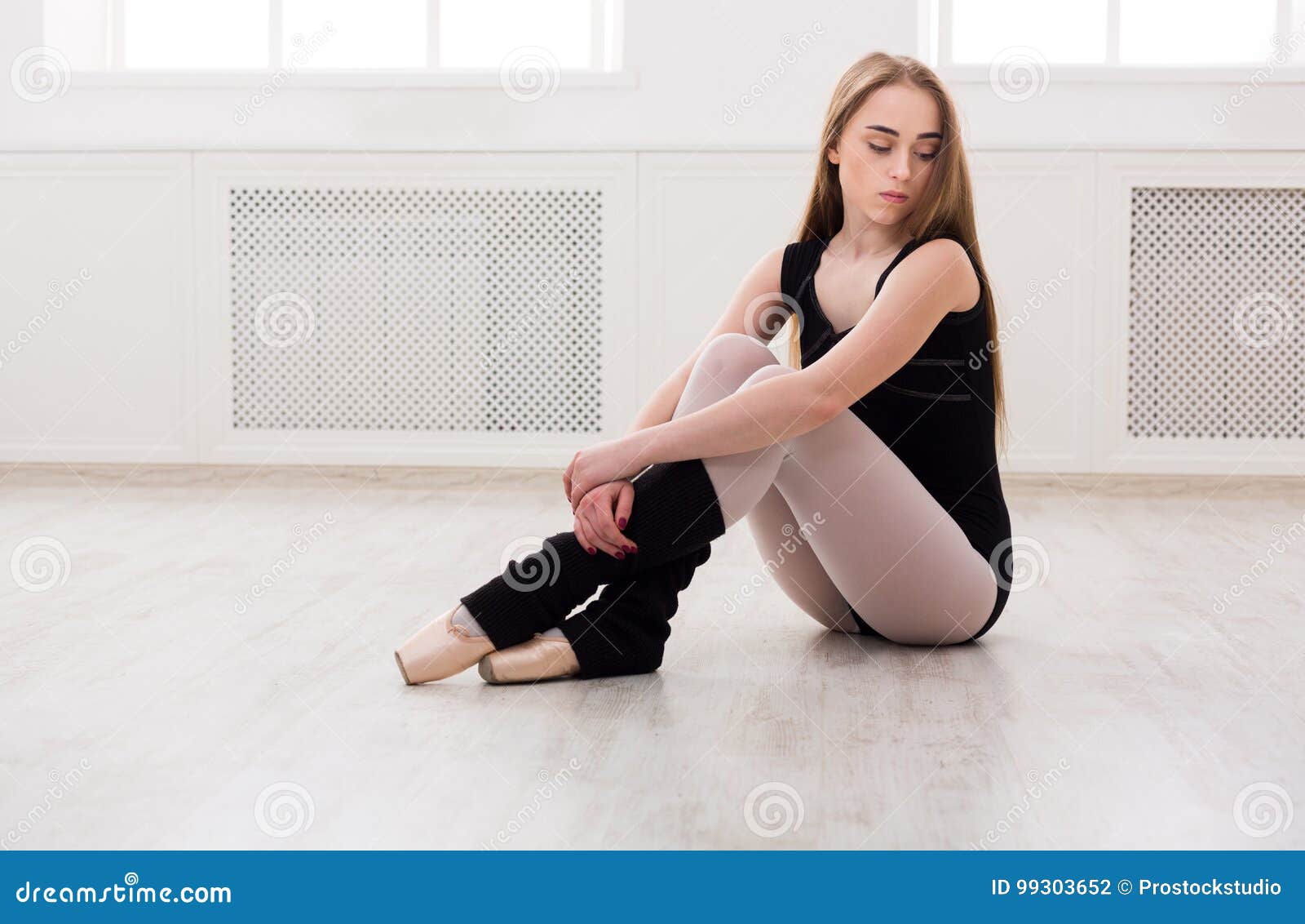 Classical Ballet Dancer Stretching in White Training Class Stock Photo ...